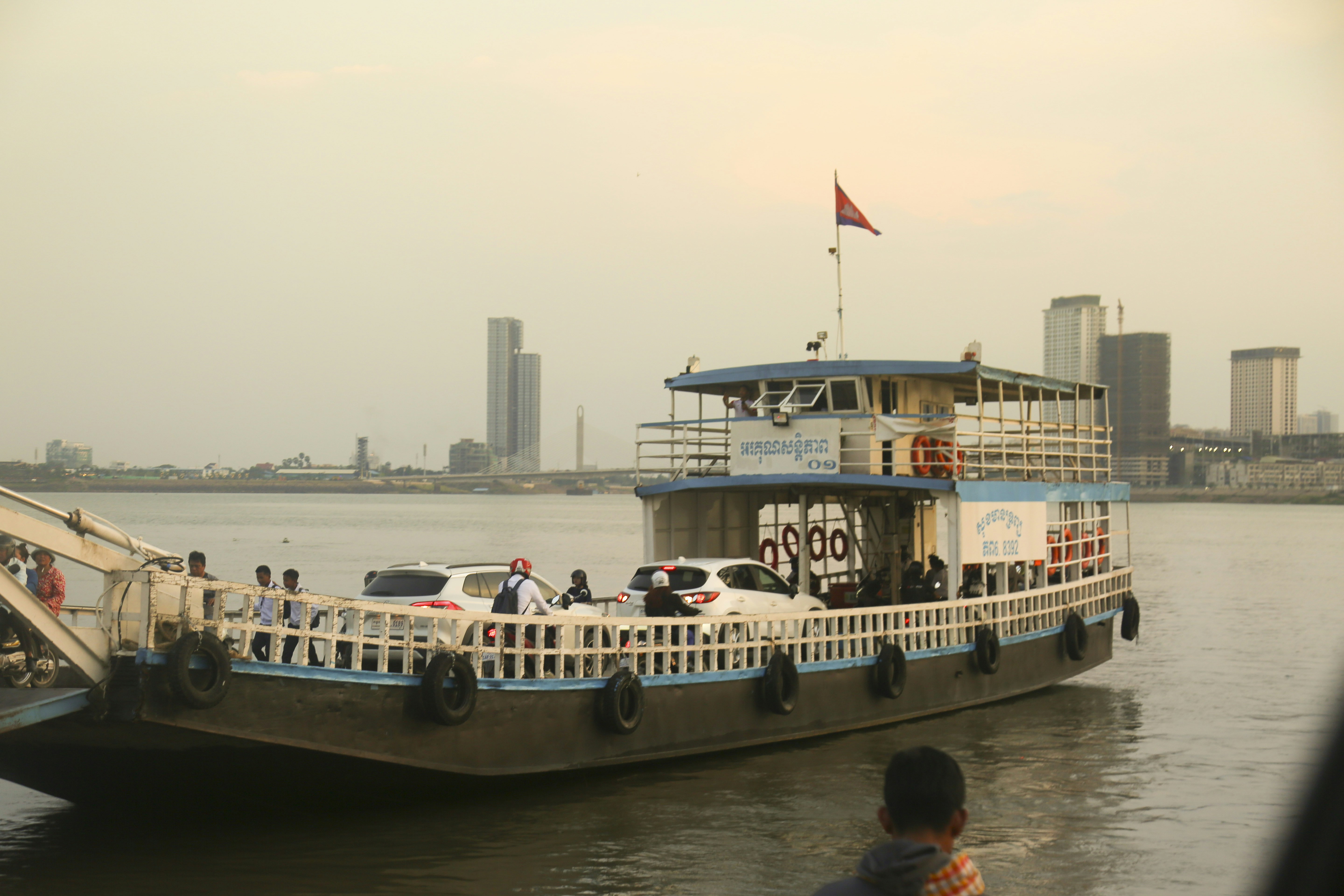City Ferry at Dusk: A Double-Decker Bound by the River