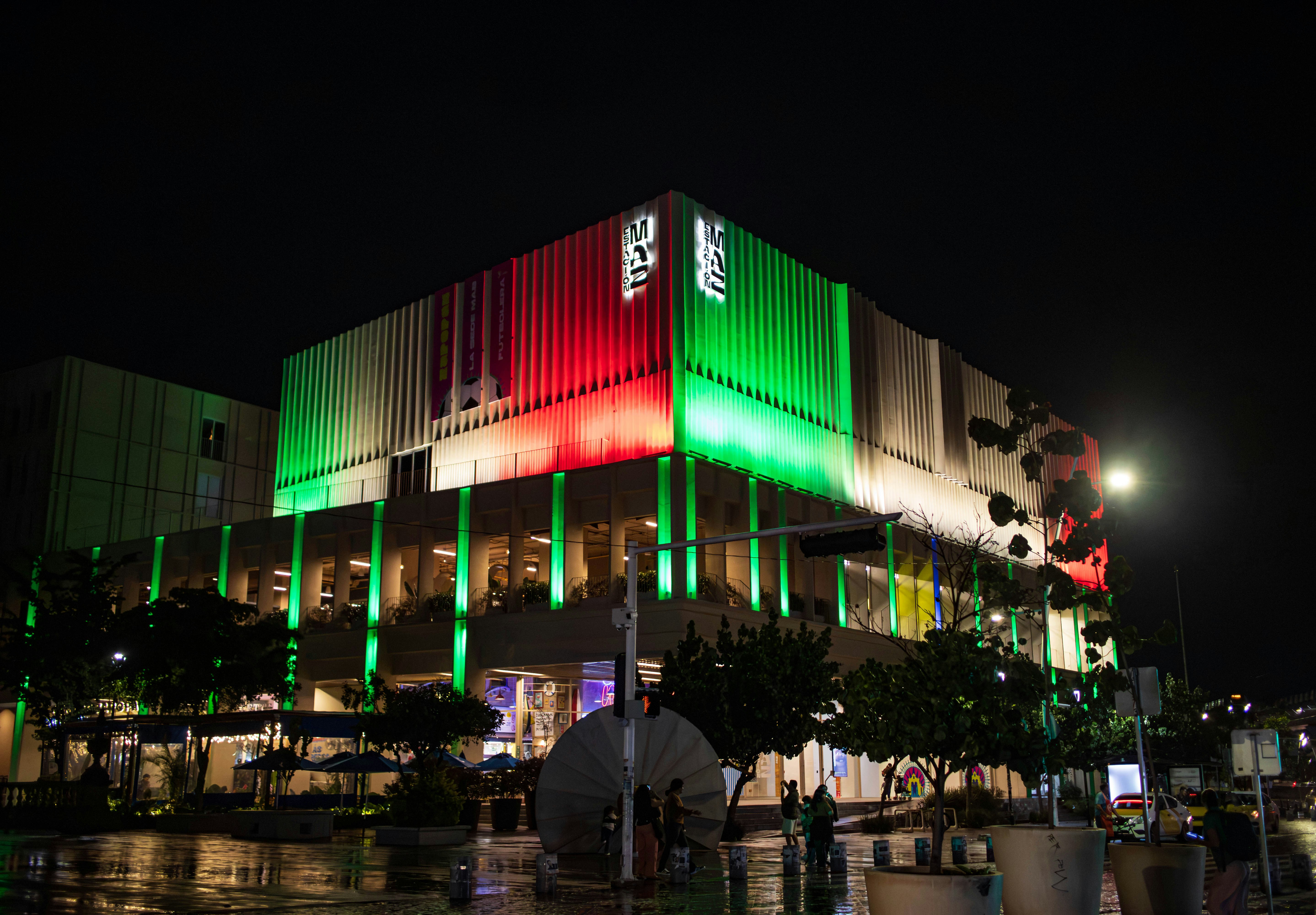 Neon Facade: Night Light Cascades Across a Modern Cultural Center