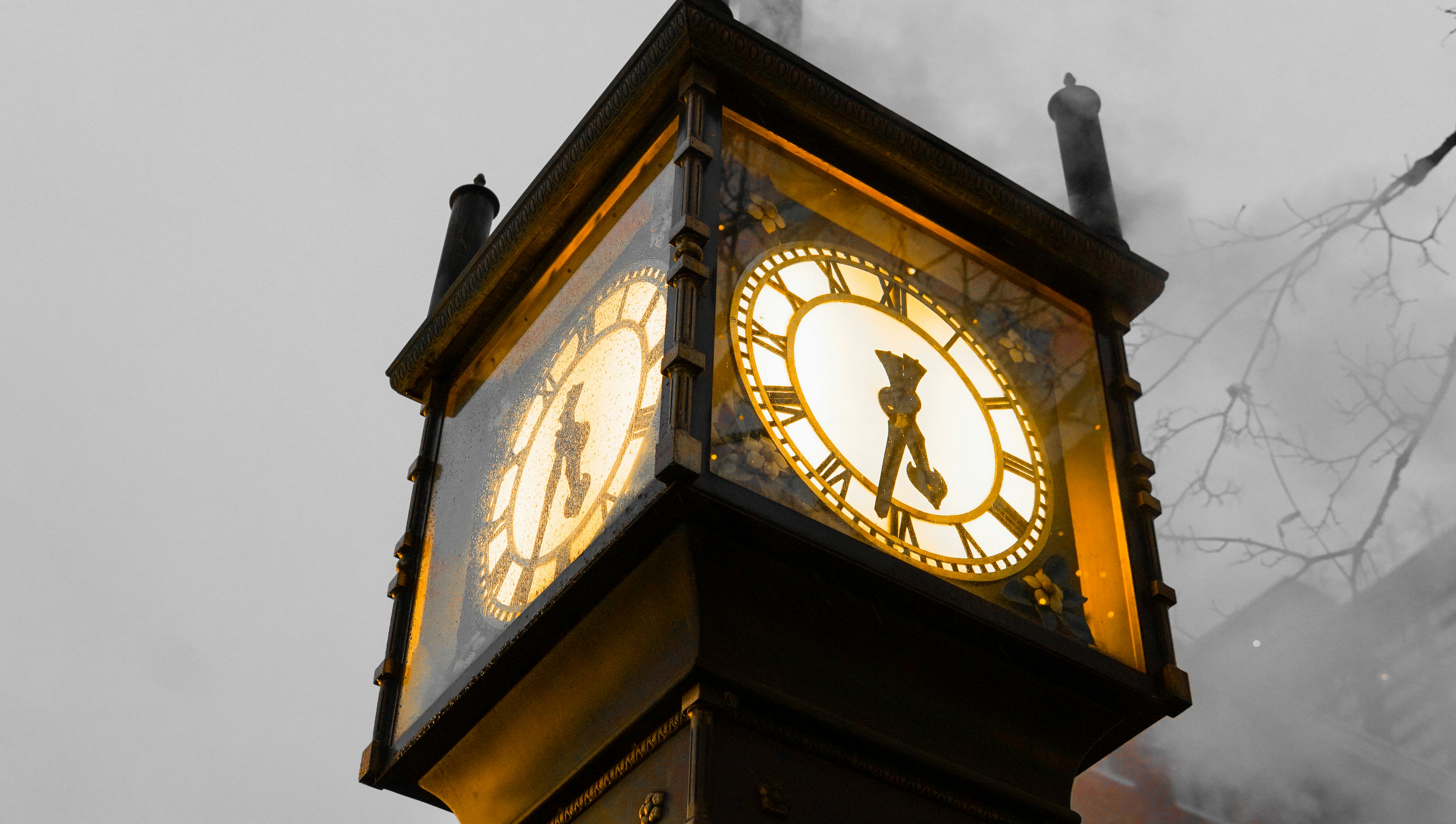 Timeless Glow: Clock Tower in Evening Mist