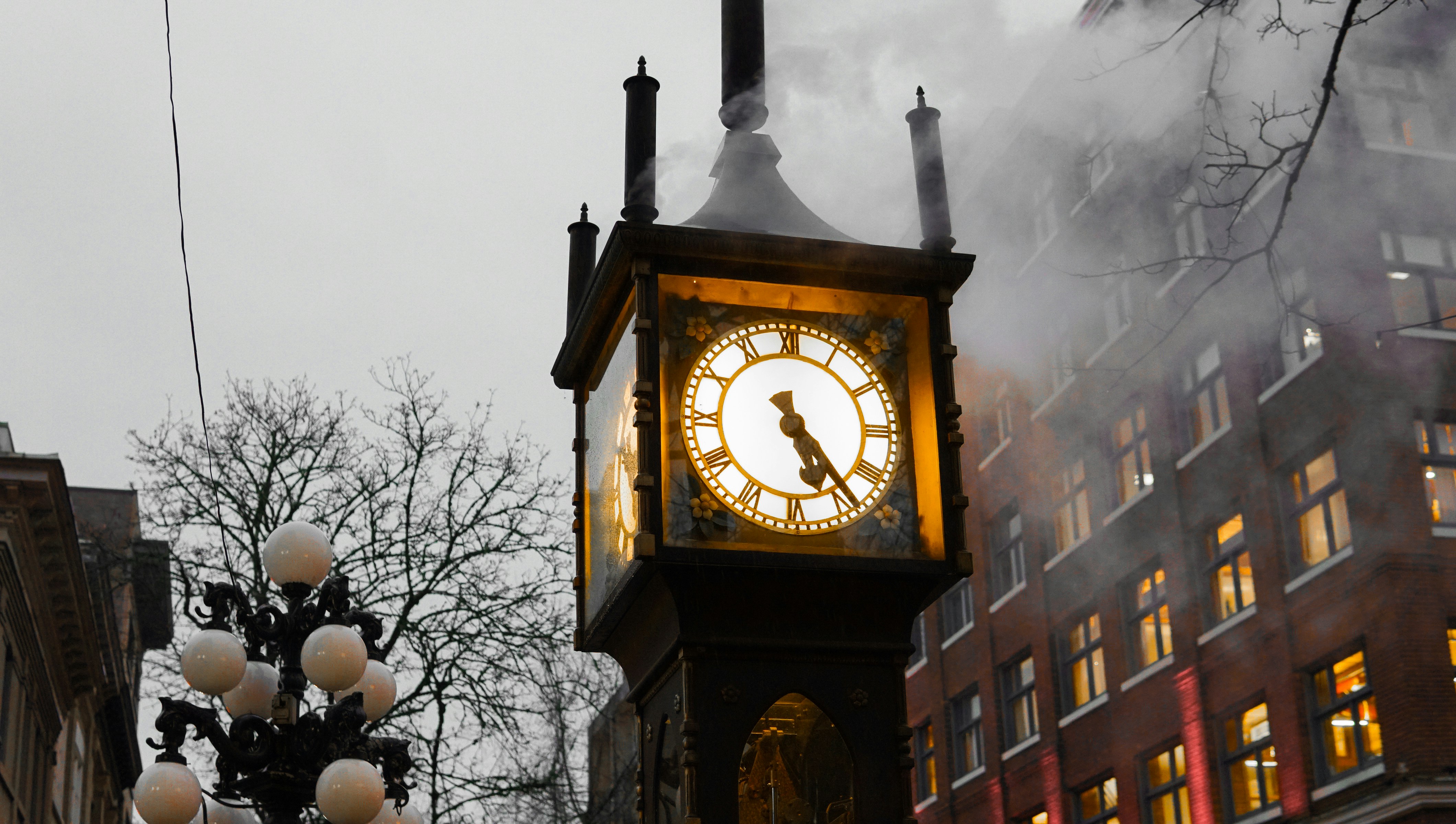 Steam-kissed Clock Tower in an Urban Winter Glow