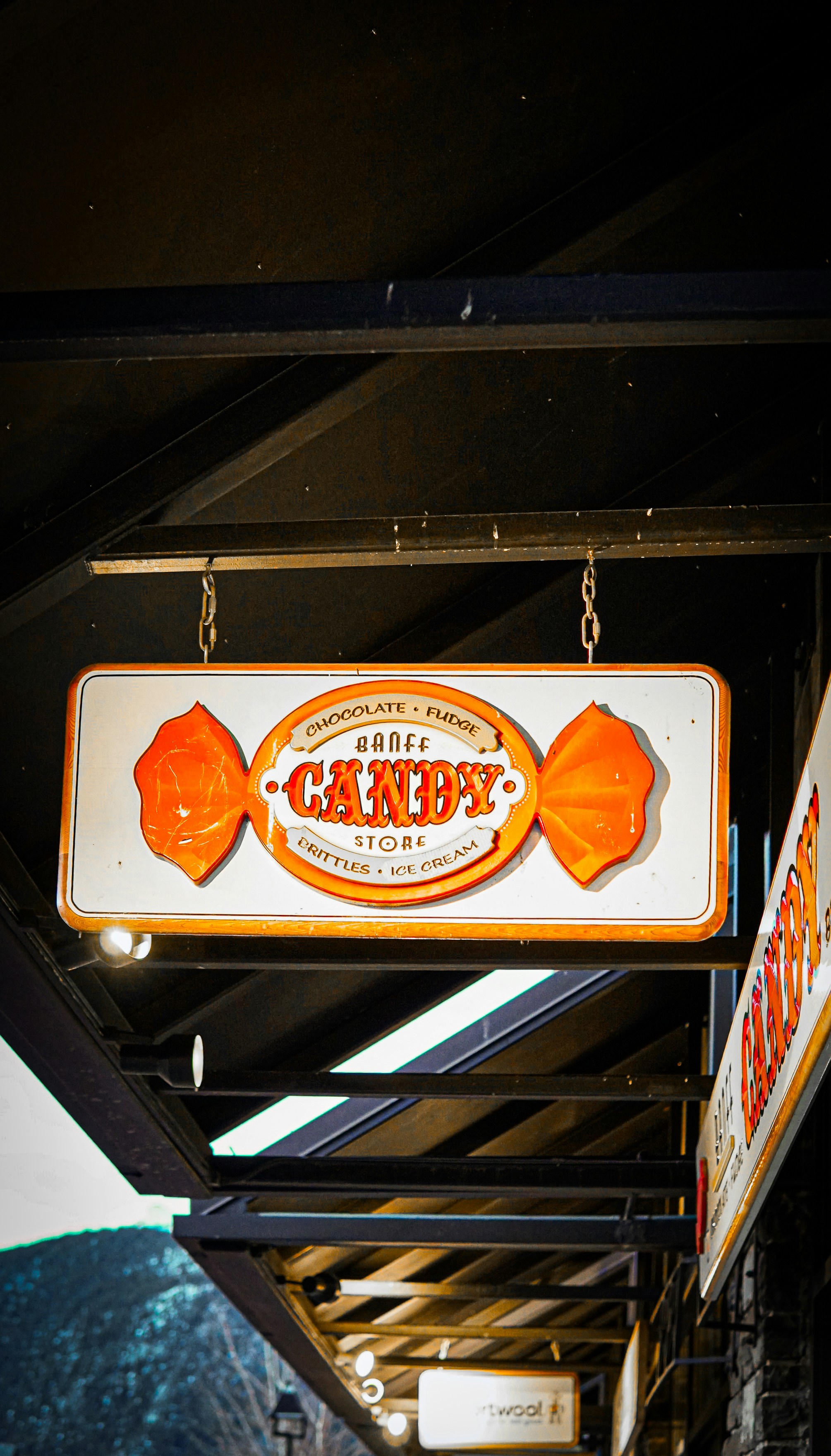 Candy Sign in a Neon-Milled Night Market Scene