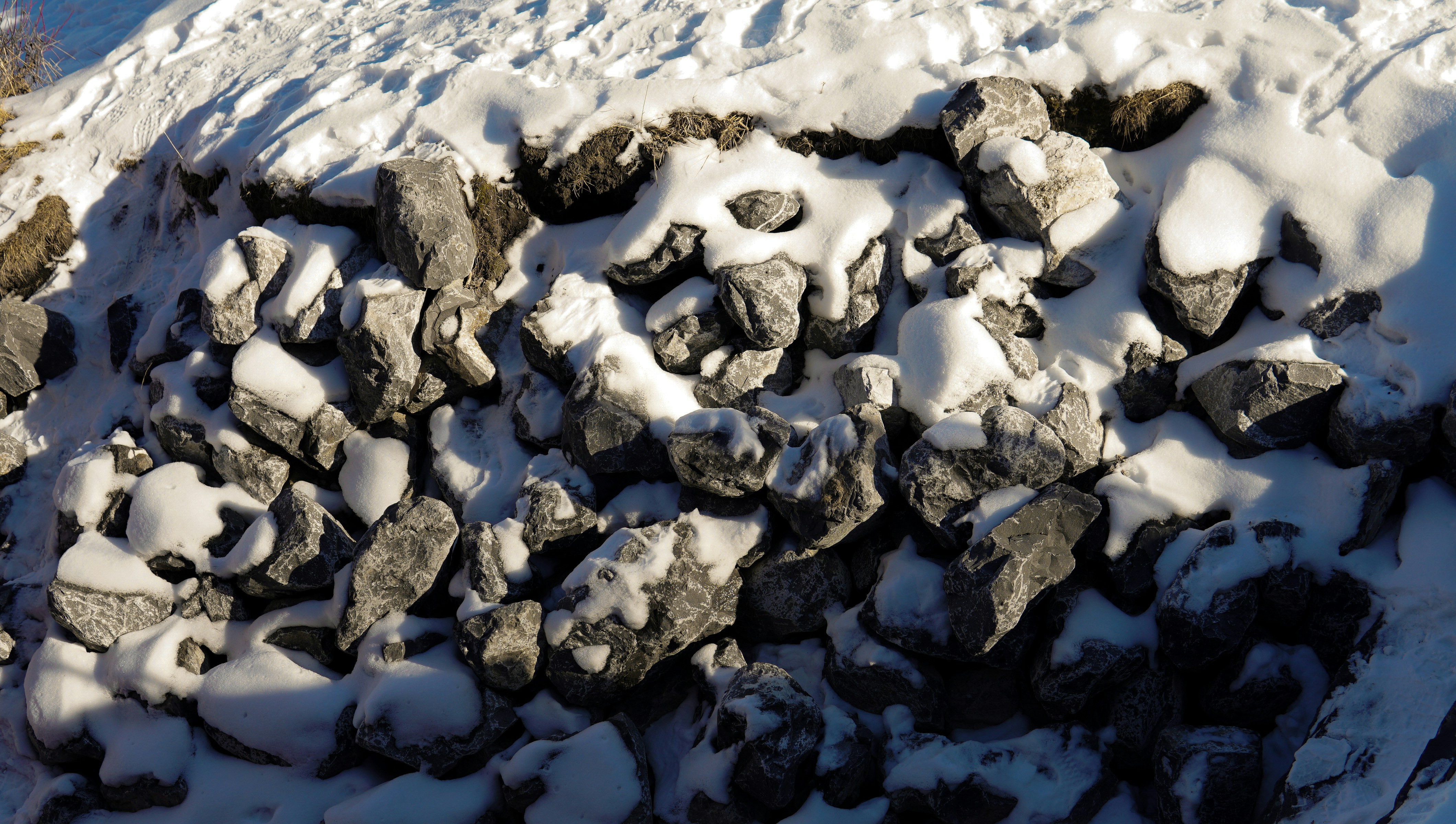 Snow-kissed Gravel and Stone Wall
