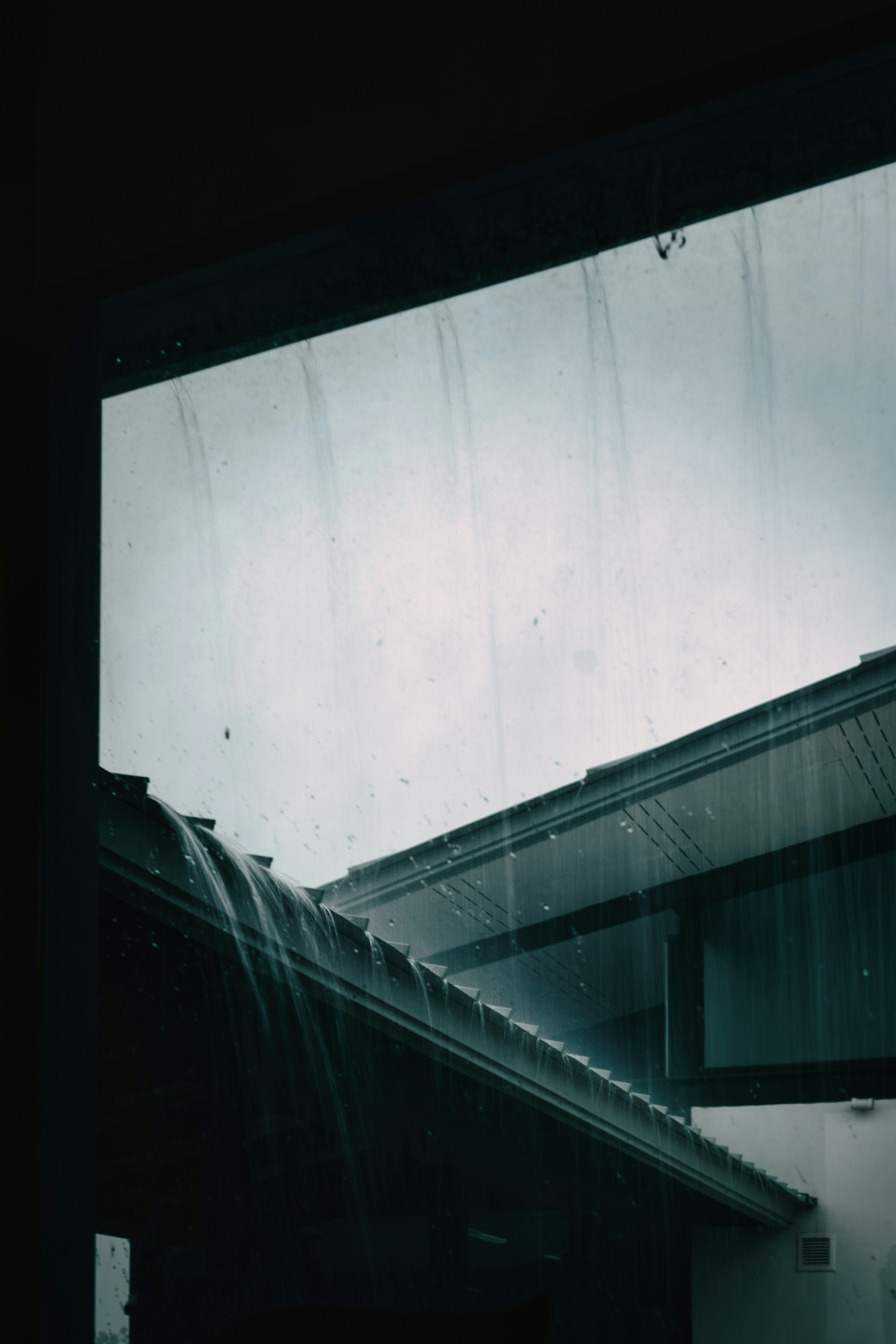 Rain-Perforated Glass and Overhanging Roof