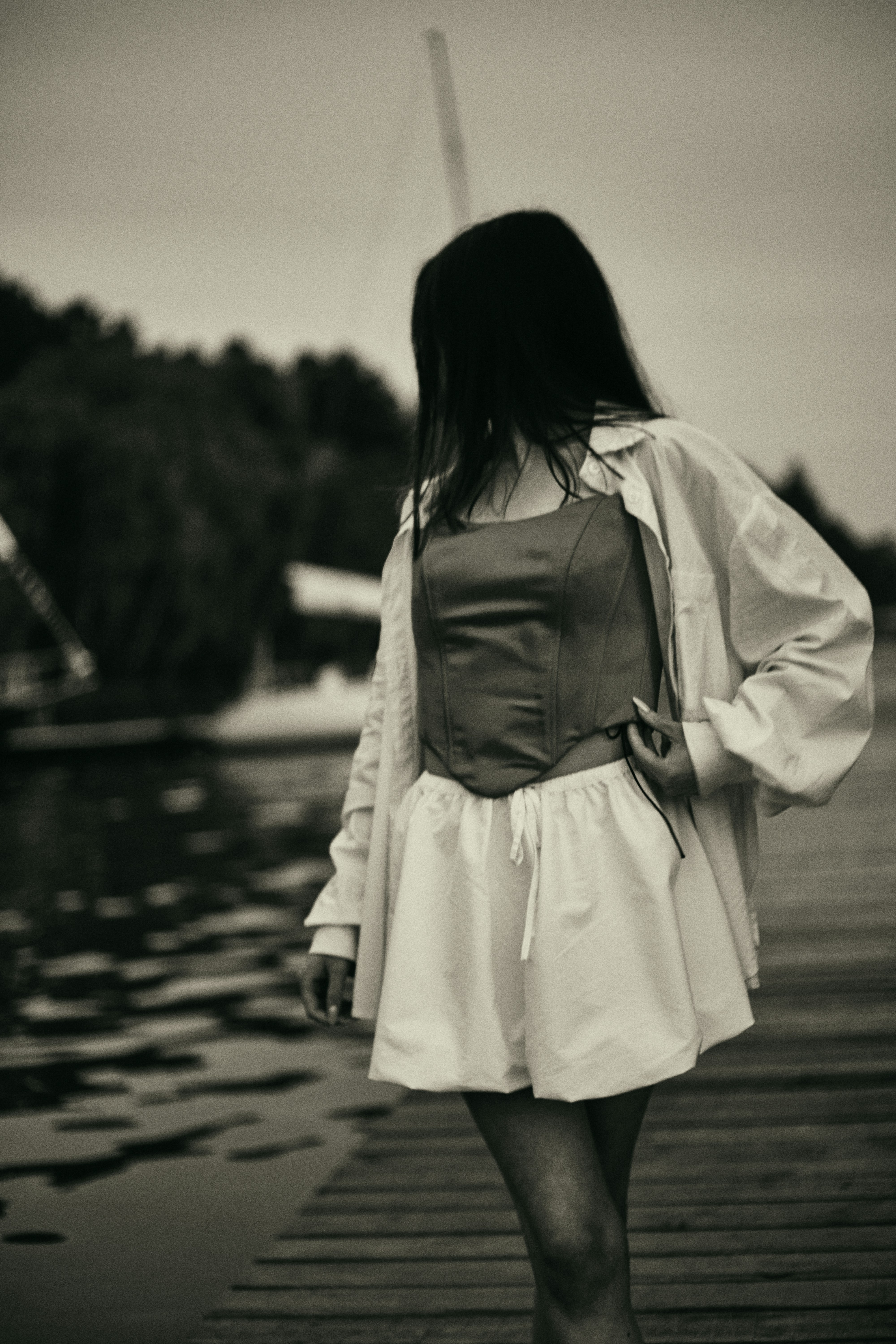 Silhouette at the Edge: A Portrait on the Quiet Docks