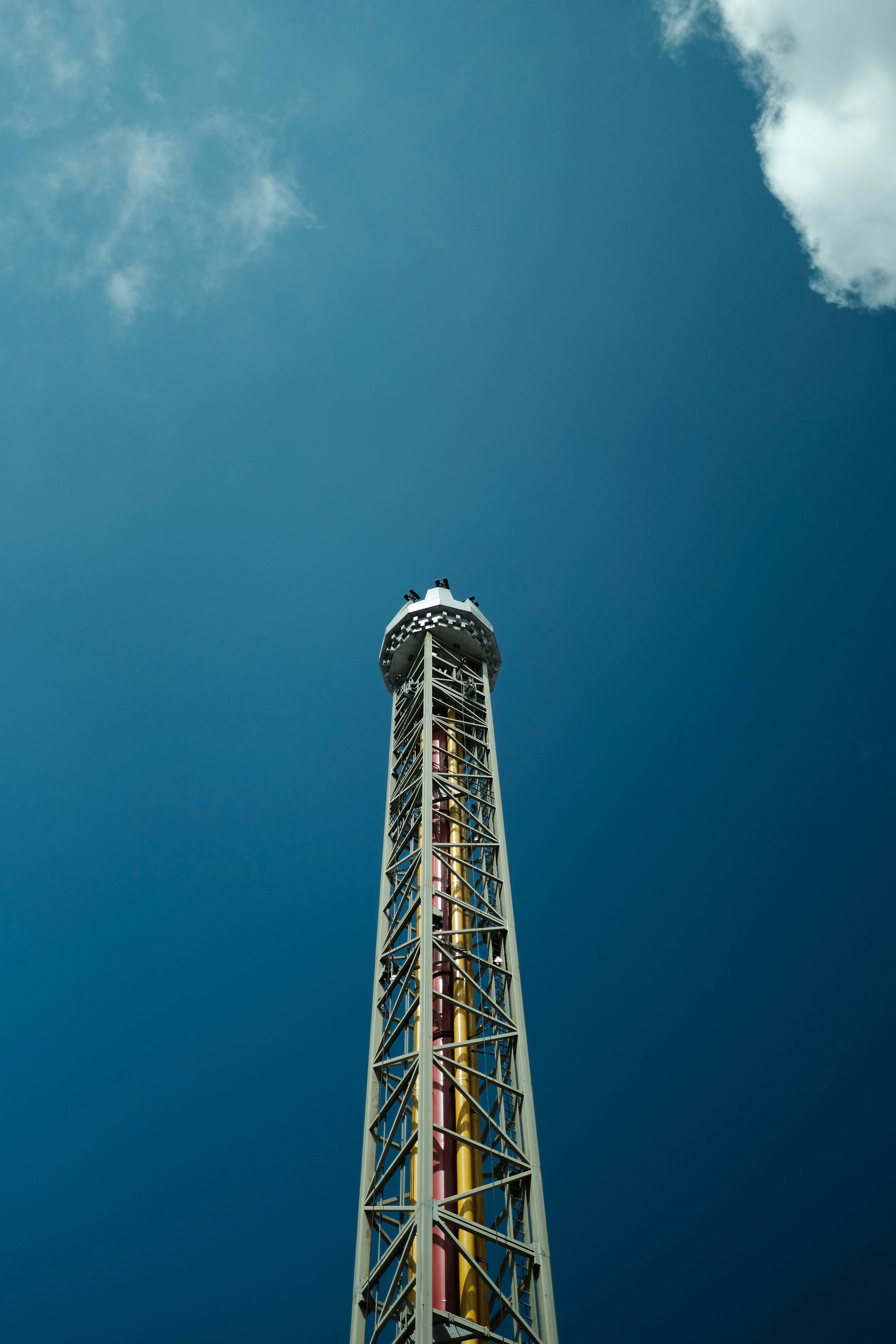 Vertical Ascent: The Tower Reaching Toward a Cerulean Sky