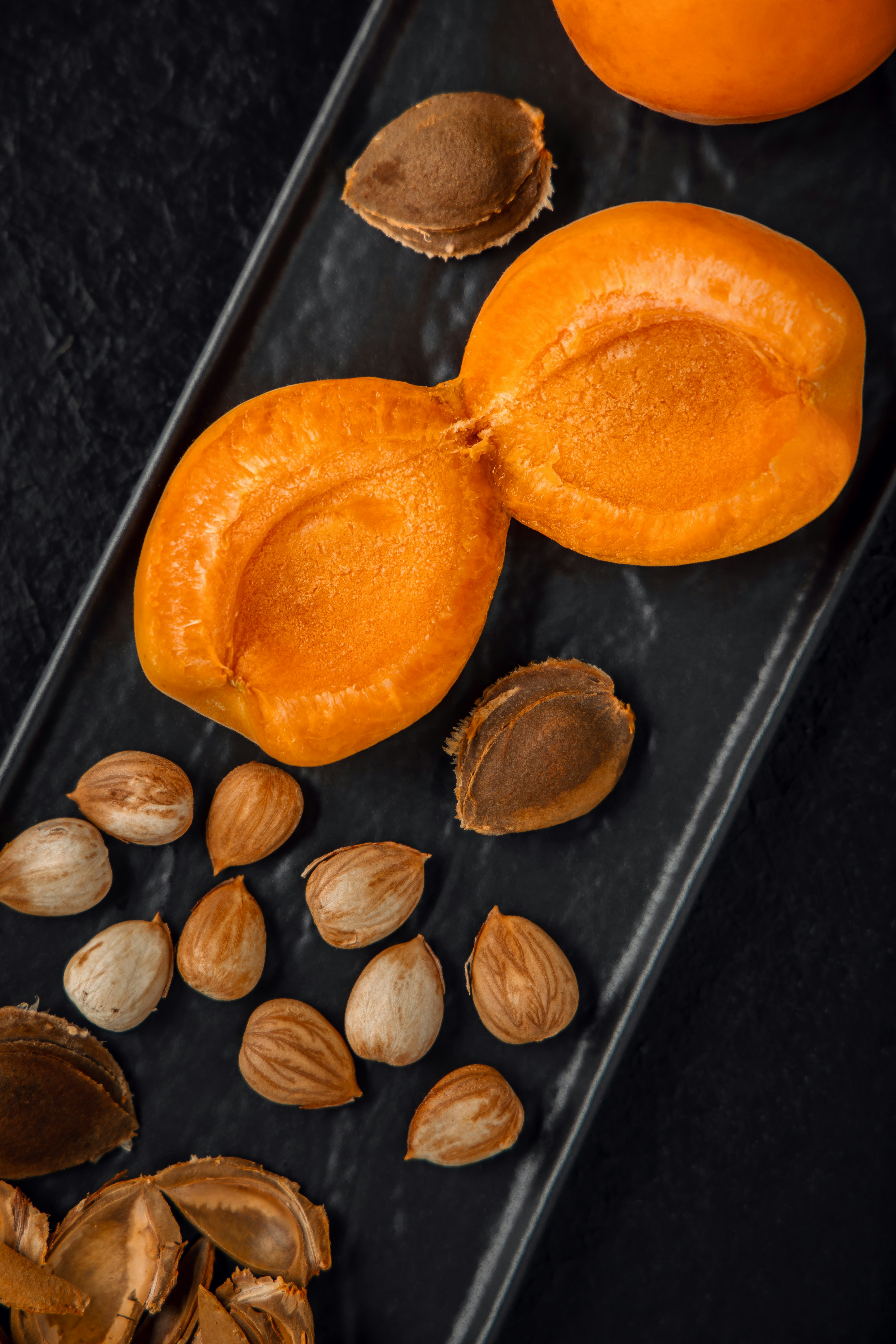 Golden Halves and Tiny Seeds on a Slate Slab