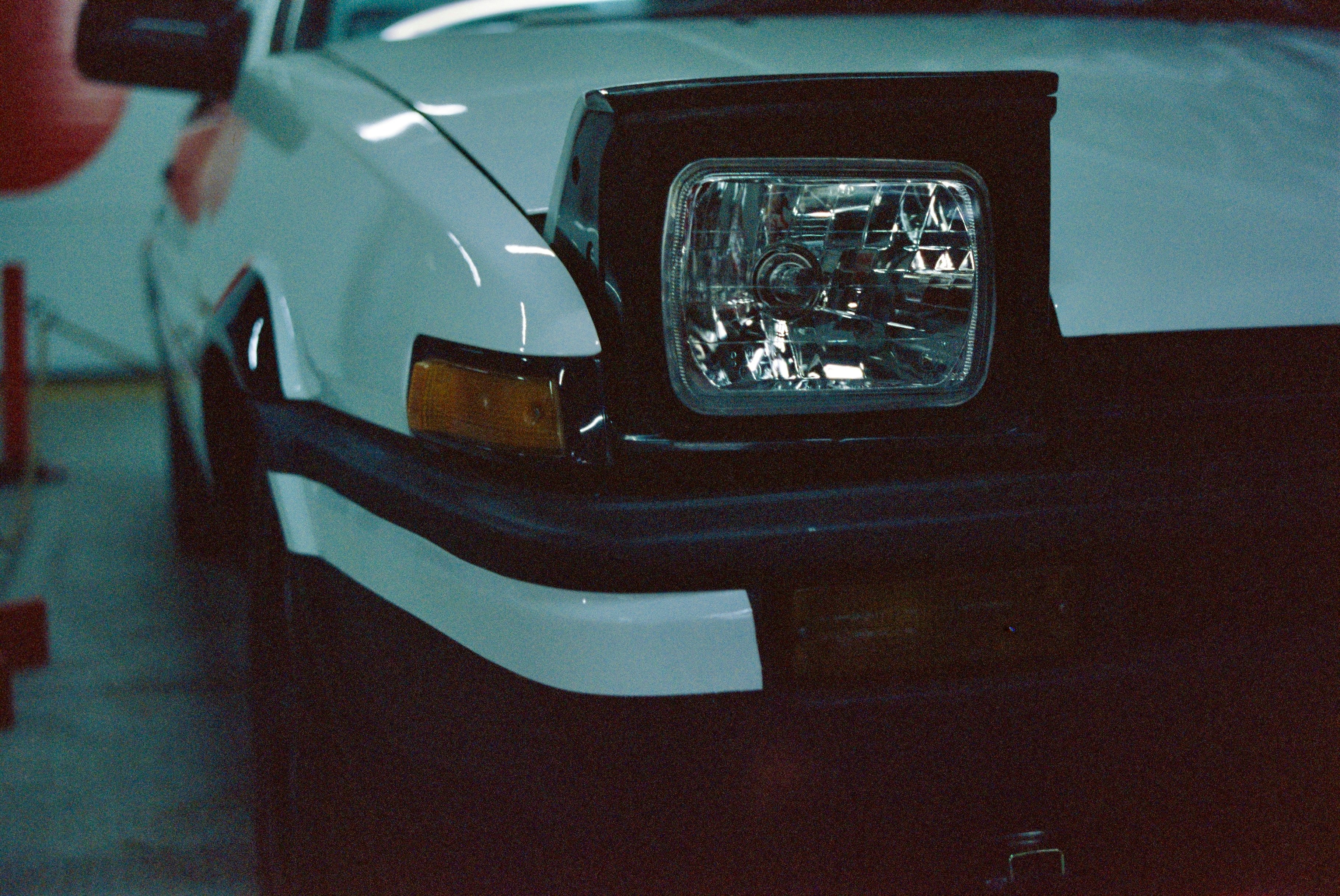 Headlight Gaze: A Vintage Front Quarter in Cool Automotive Neon
