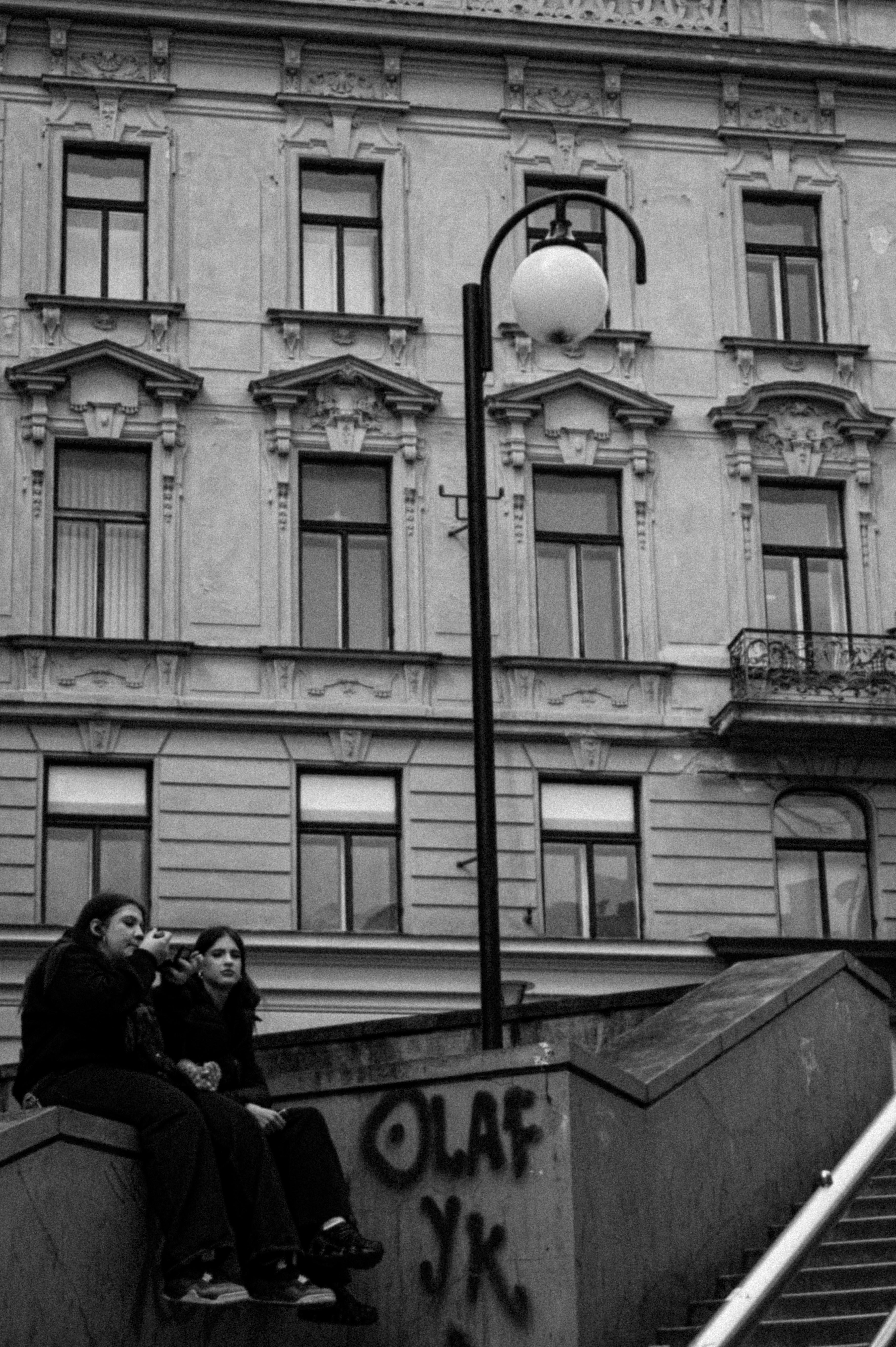 Three on a Terrace: Streetlight and Curious Gaze