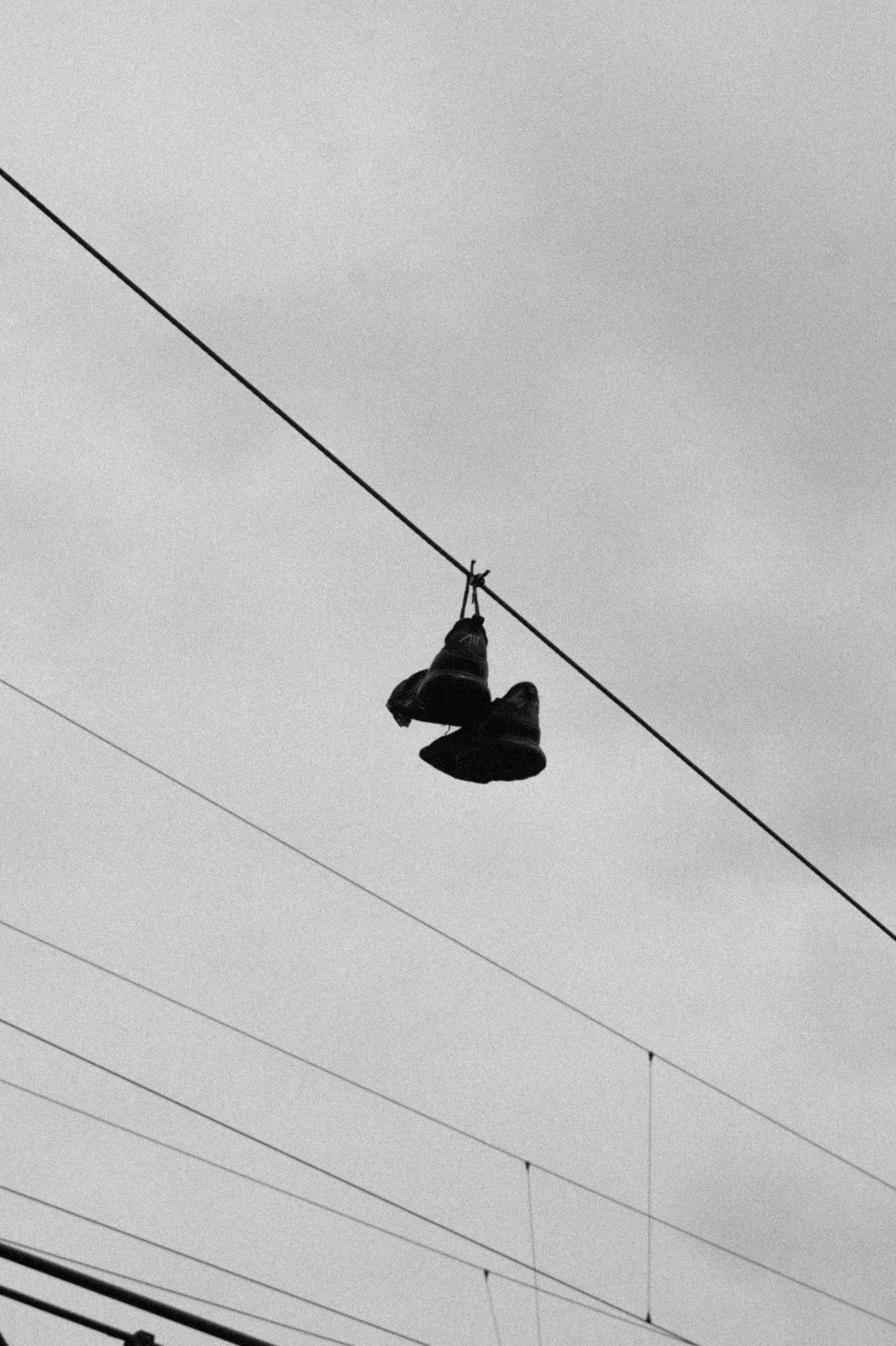 Hanging Shoes Above Quiet Rails