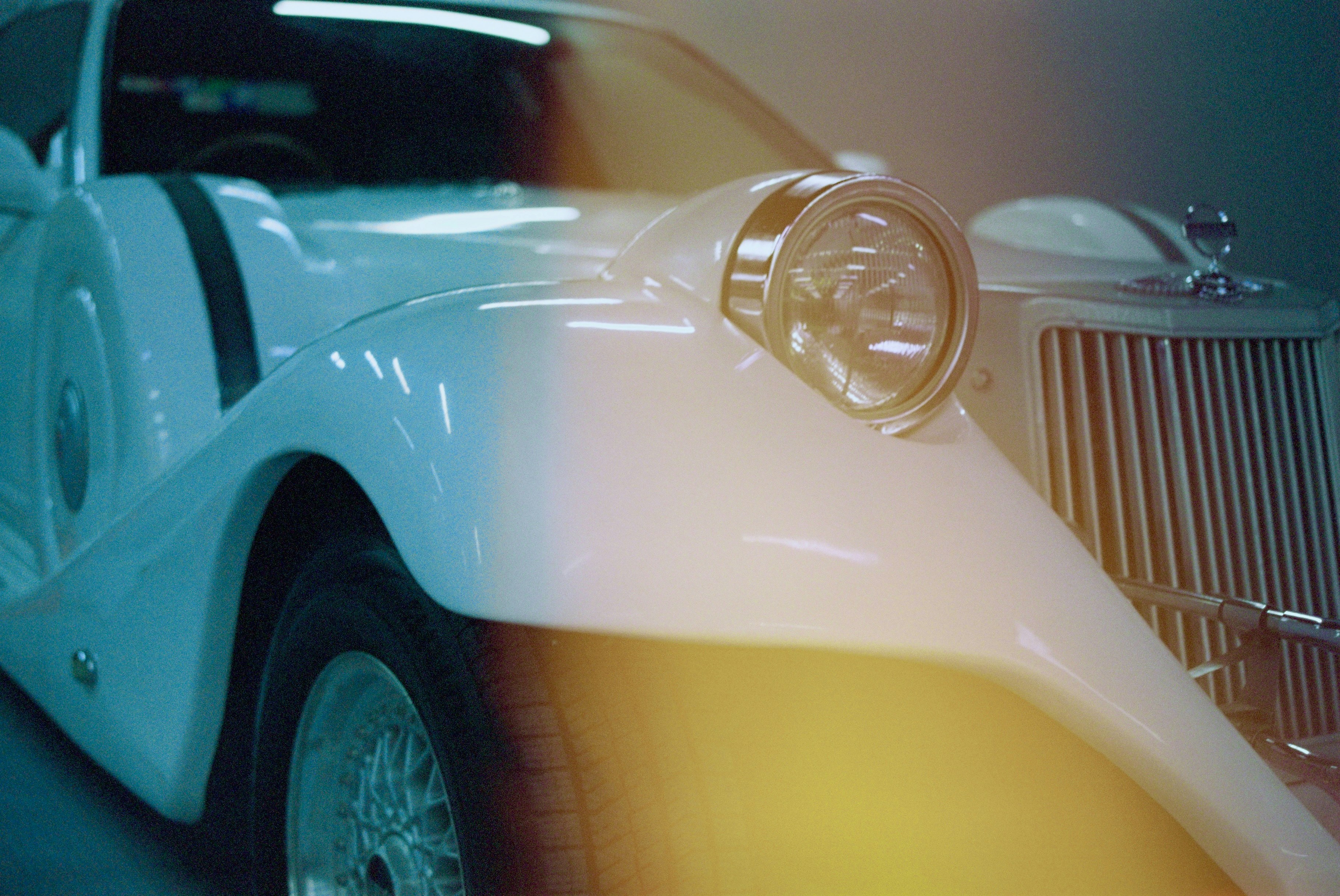 Close-Up of a Vintage Car's Front Profile with Soft Light Spill