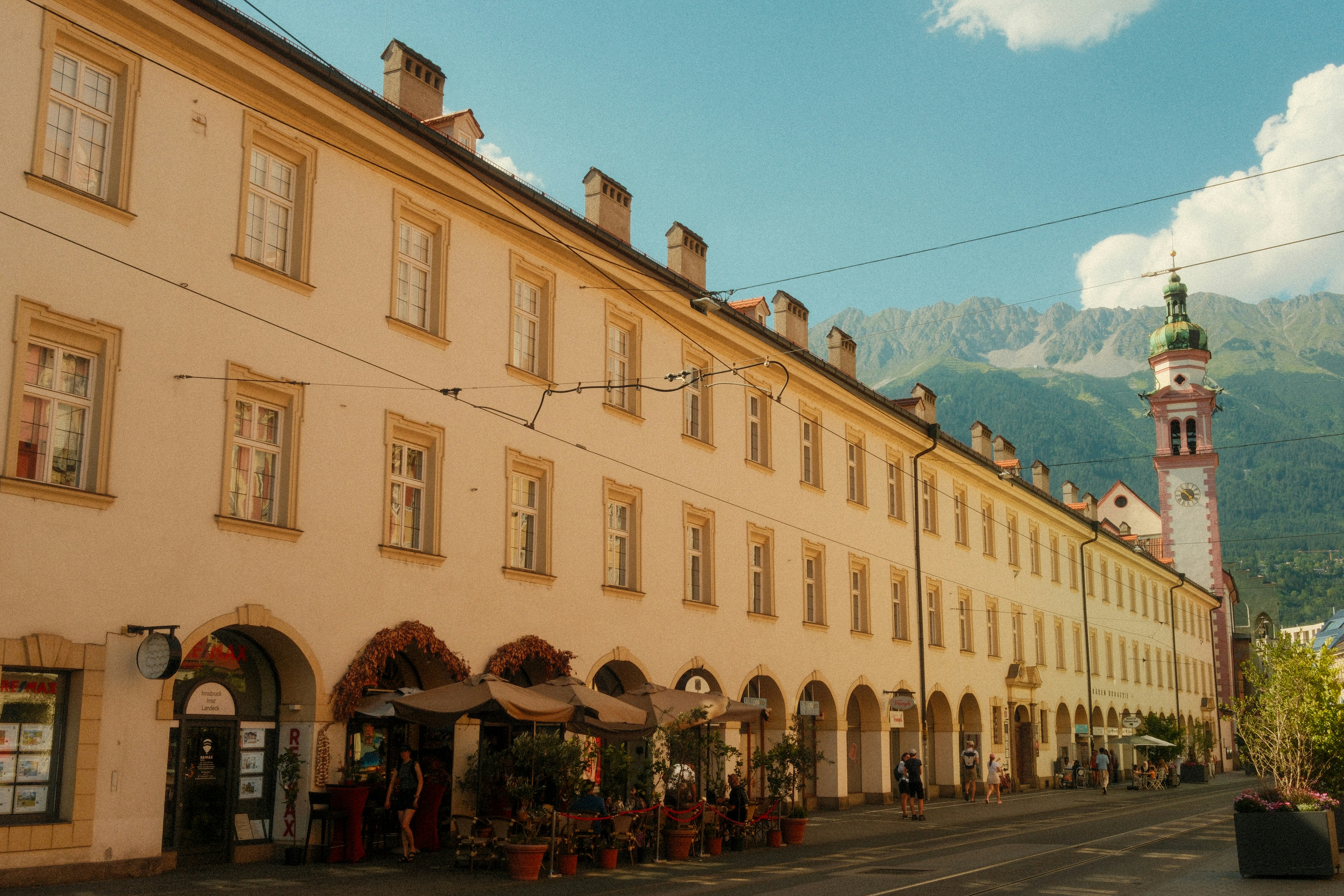 Sunlit Arcade Street in Alpine Town
