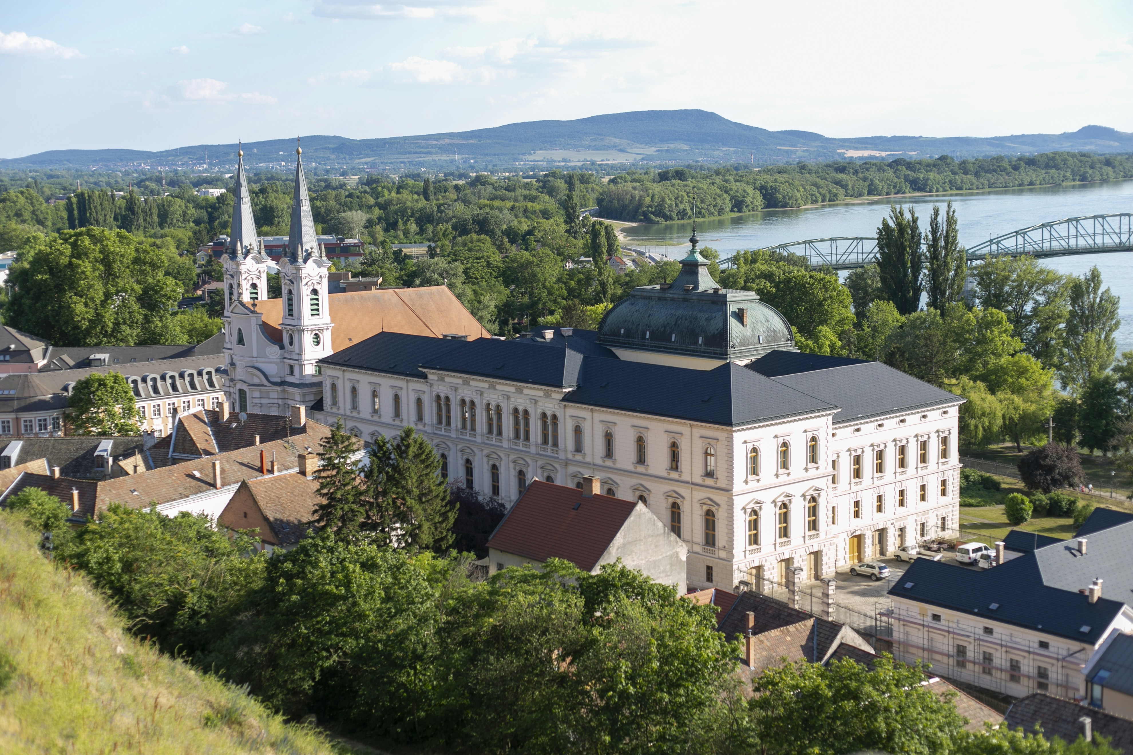 Aerial View of a Historic Riverside Complex with Towers