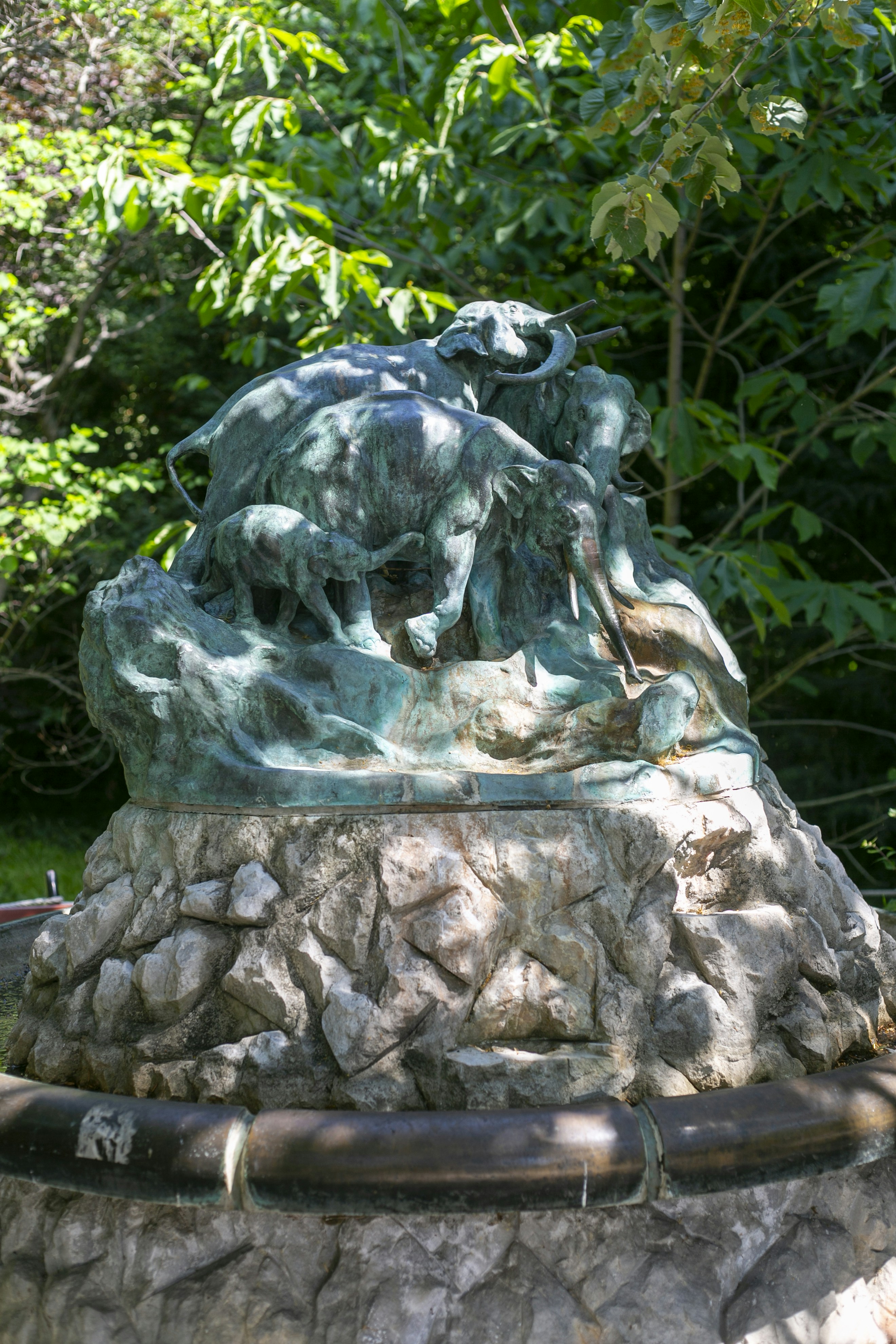 Bronze Bull and Ranger of Stone in Dappled Garden