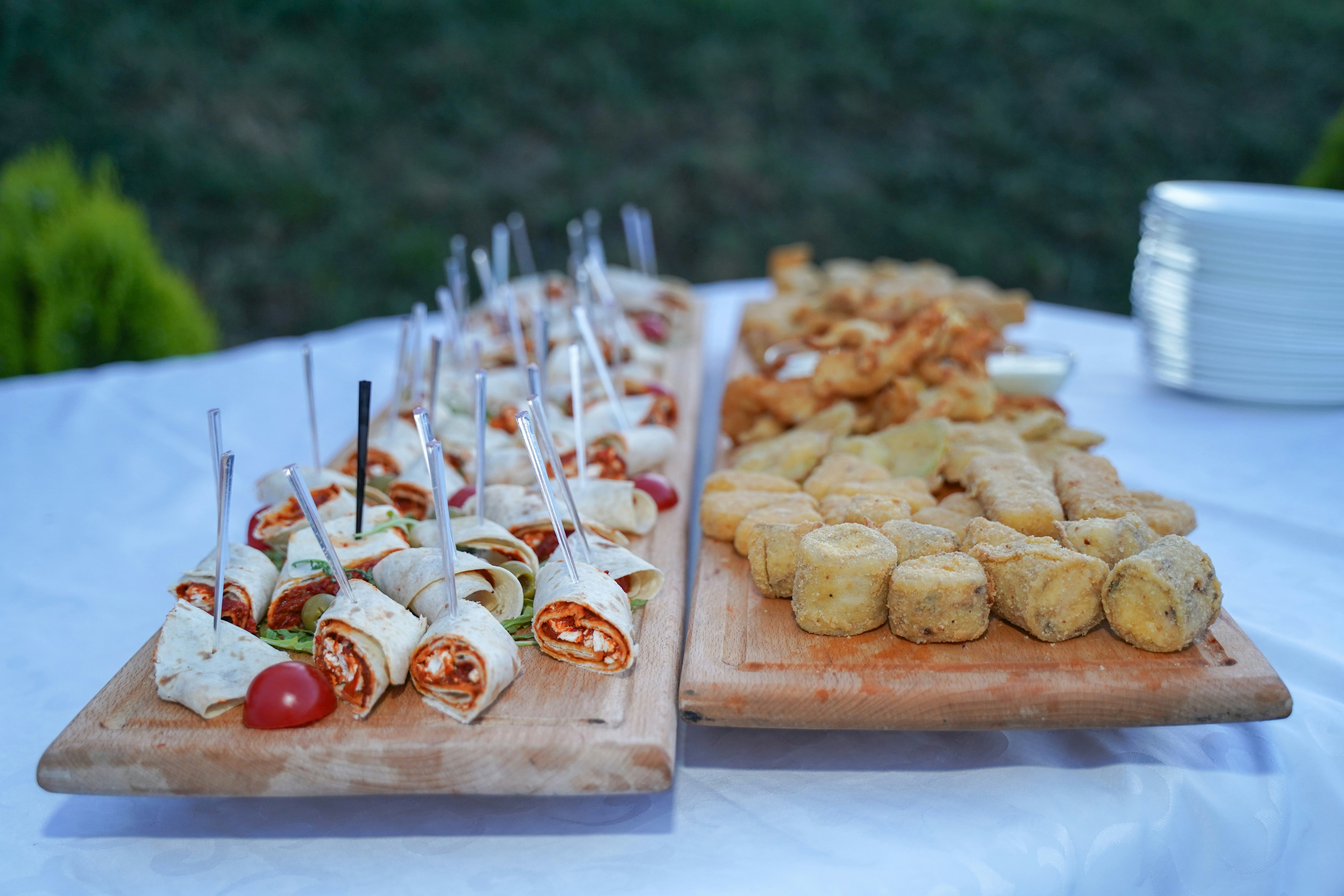 Savory Bites on Wooden Platters: A Party Spread in Soft Afternoon Light