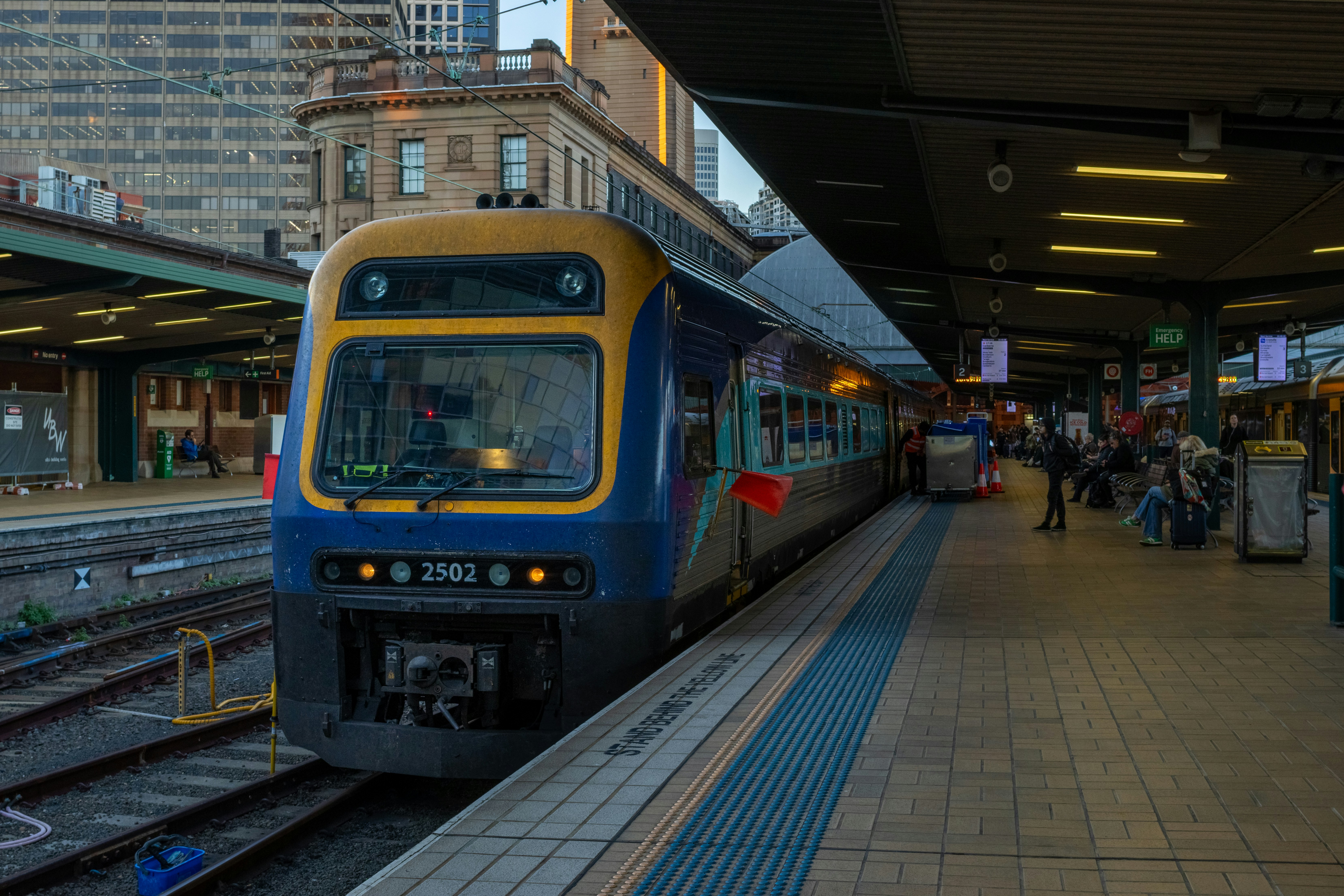 Platform Pulse: A Liverpool-Blue Locomotive Resting at Dusk