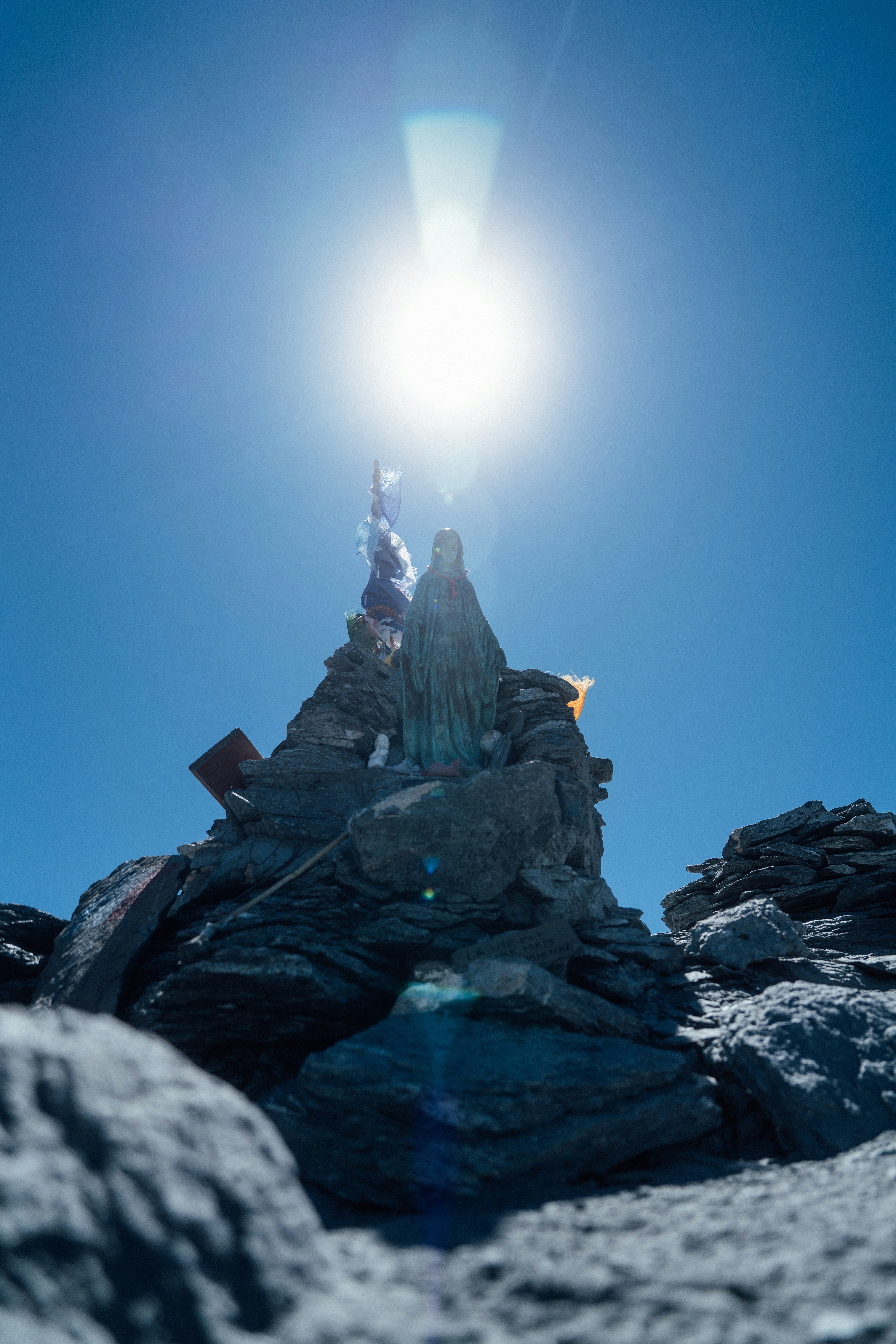 Sunlit Apex: a Sacred Figure Reaching Toward the Sky