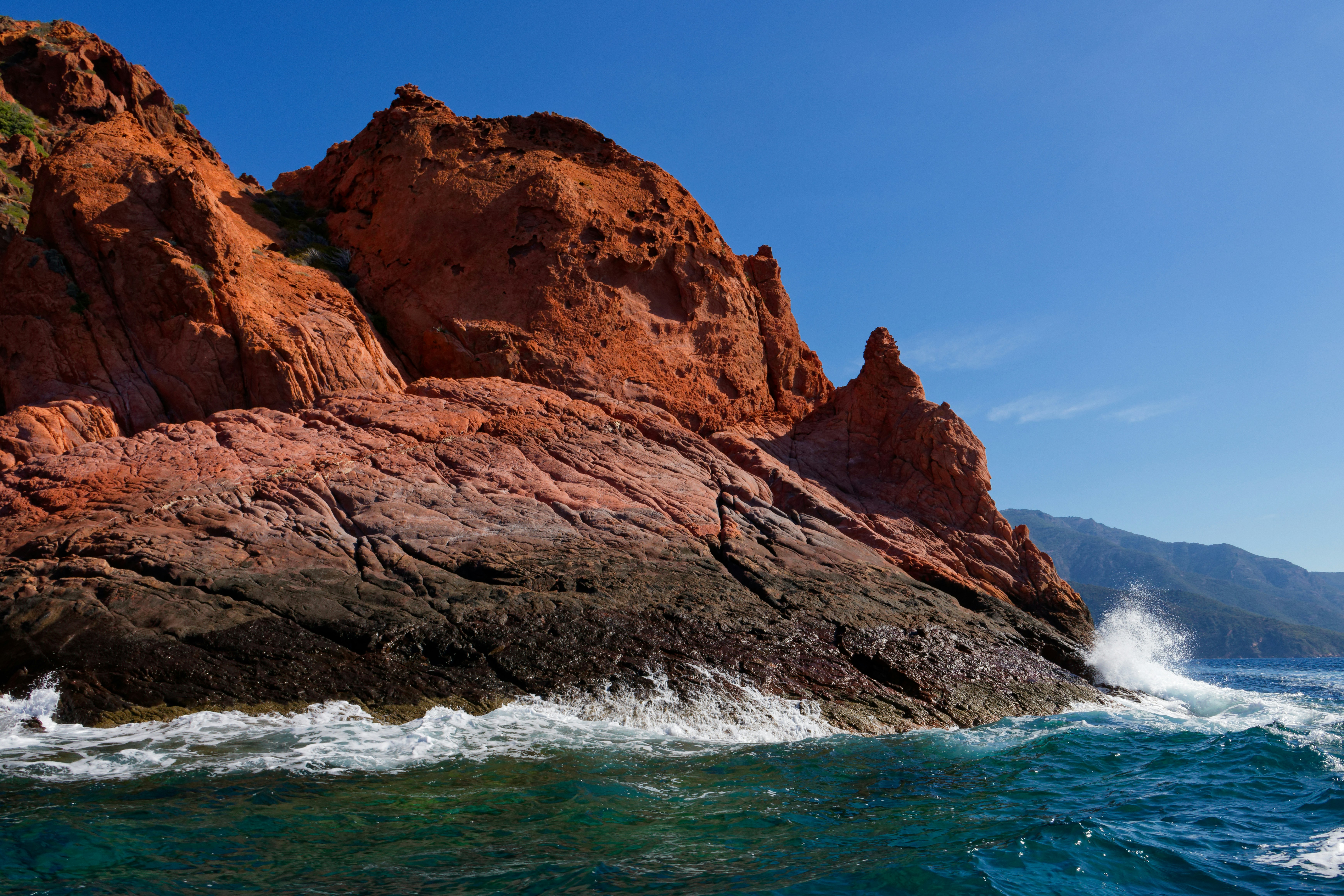 Crimson Cliffs Meet Turquoise Waters