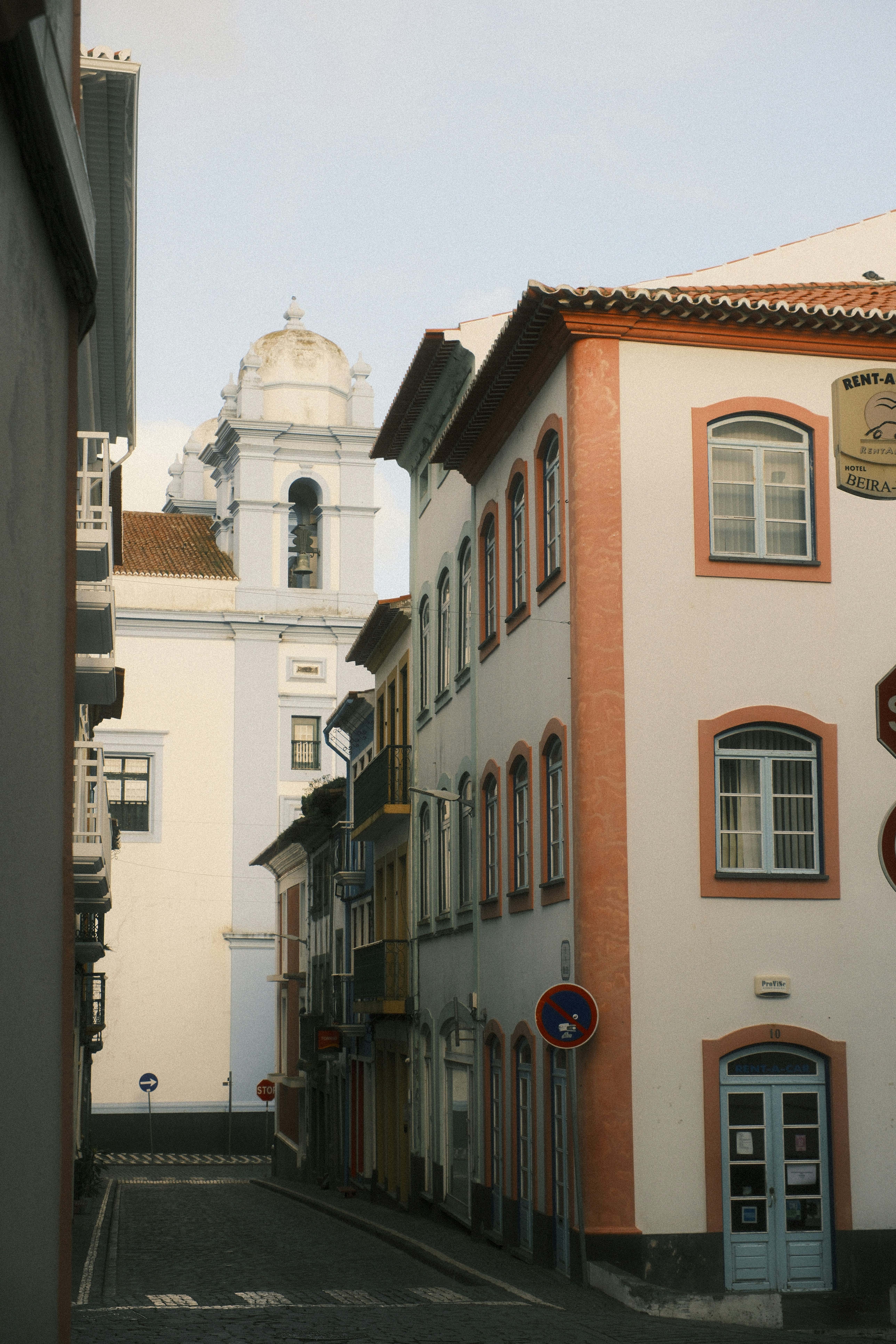 Pastel Alleys and a Bell-Tower Glow