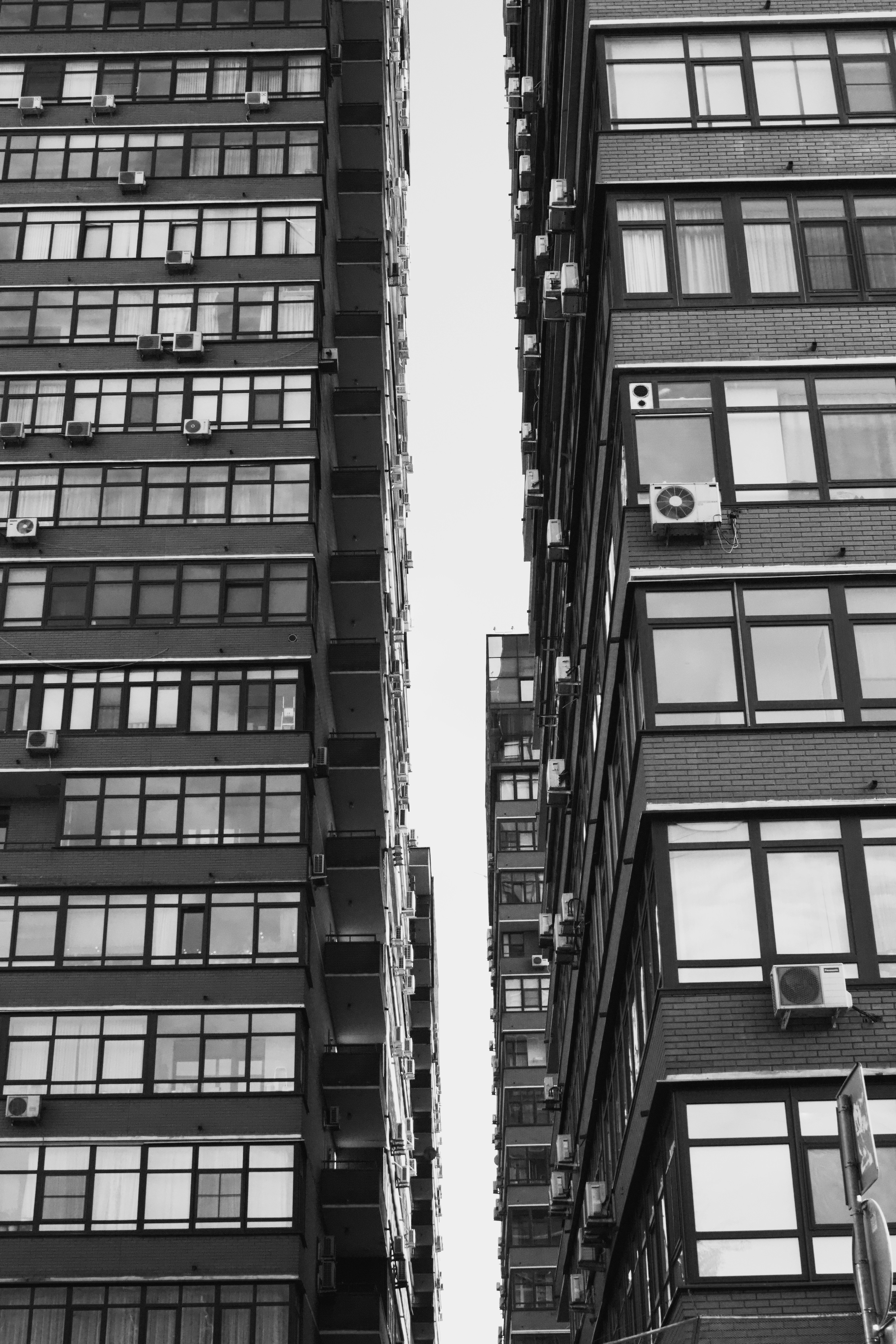 Between Facades: A Narrow Sky Divides Twin City Towers
