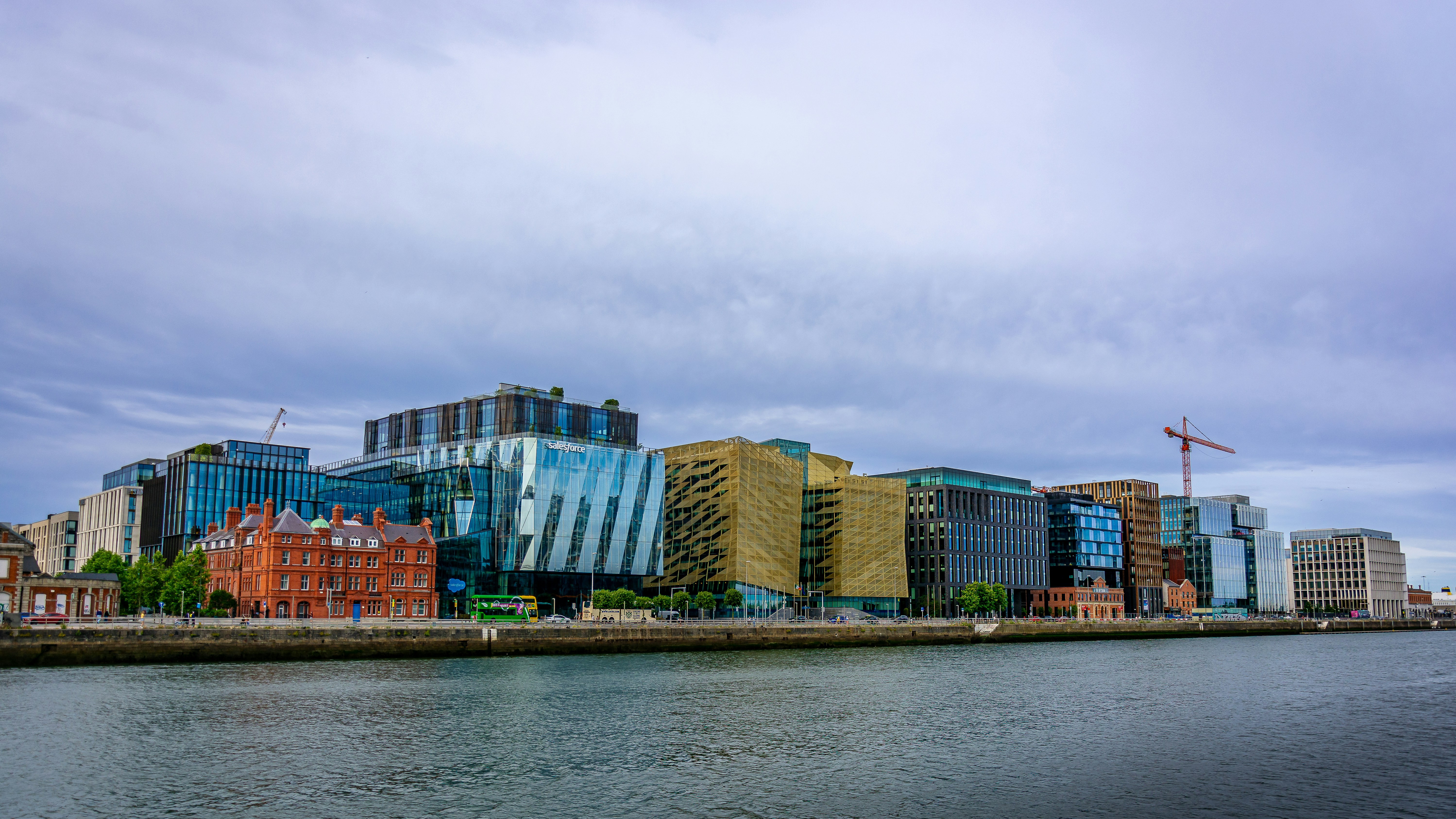 Waterfront Geometry: Modern Glass Meets Red Brick
