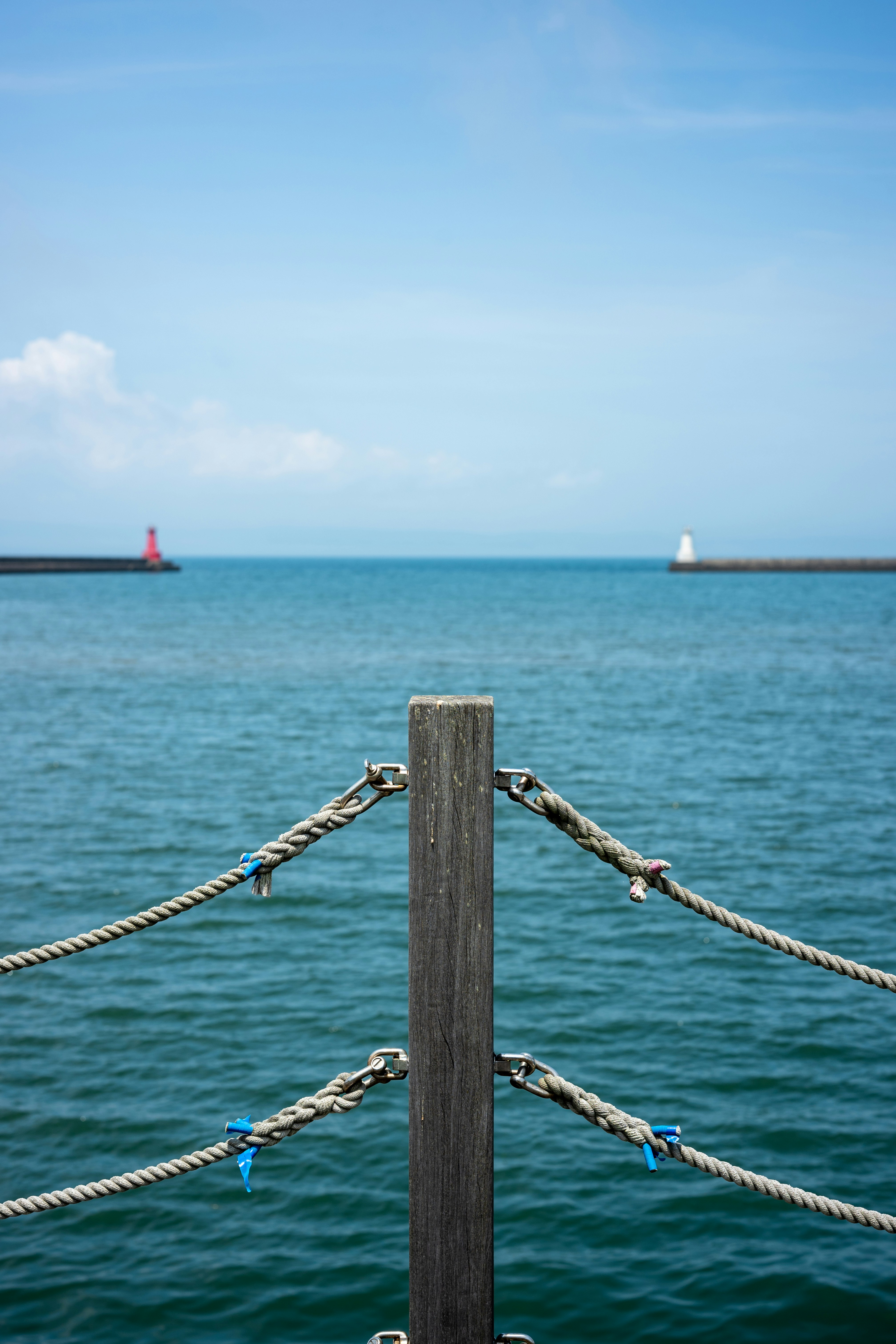 Rope-and-Sea Portal: A Wooden Pier Stretches Toward the Horizon