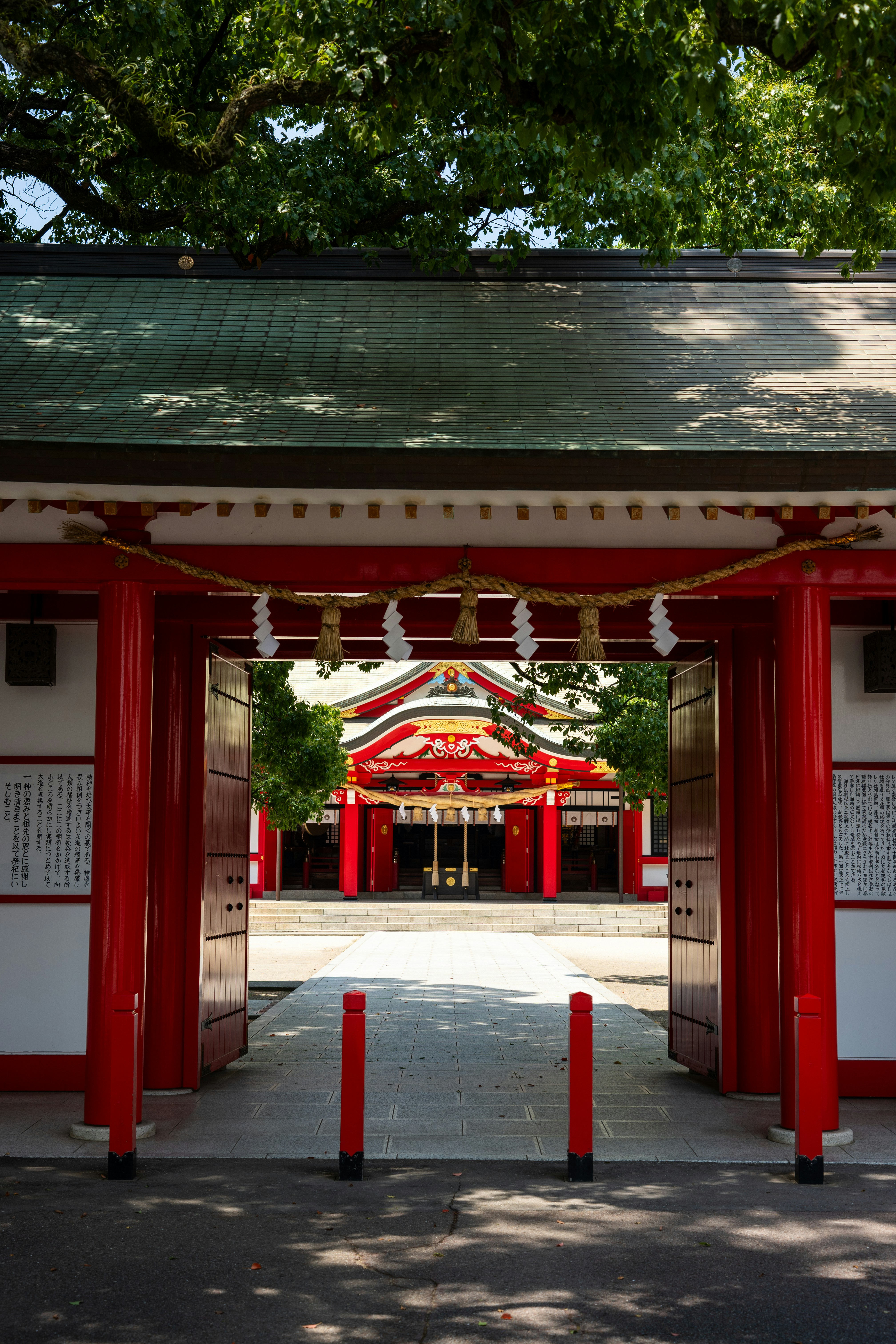 Red Gates, Quiet Path: A Shrine Portal Framed by Shade