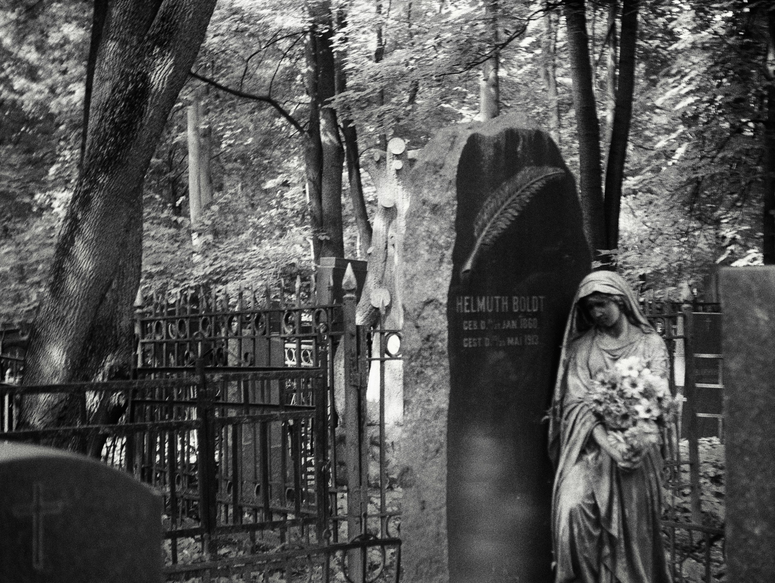 Silent Ceremony: A Bouquet Beside the Veiled Gravestone