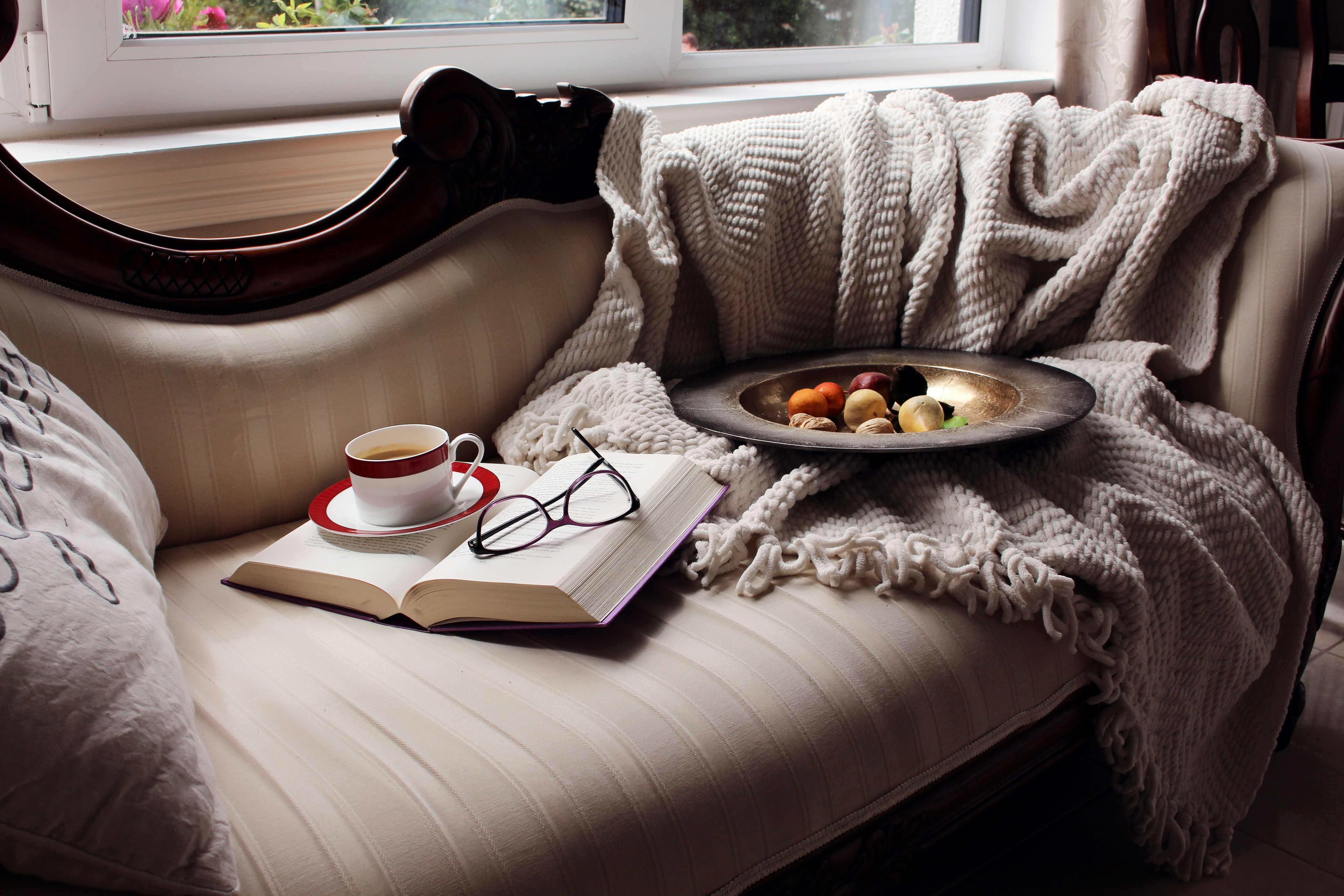 Cozy Morning on the Settee: Cup, Glasses, and Plate by the Window