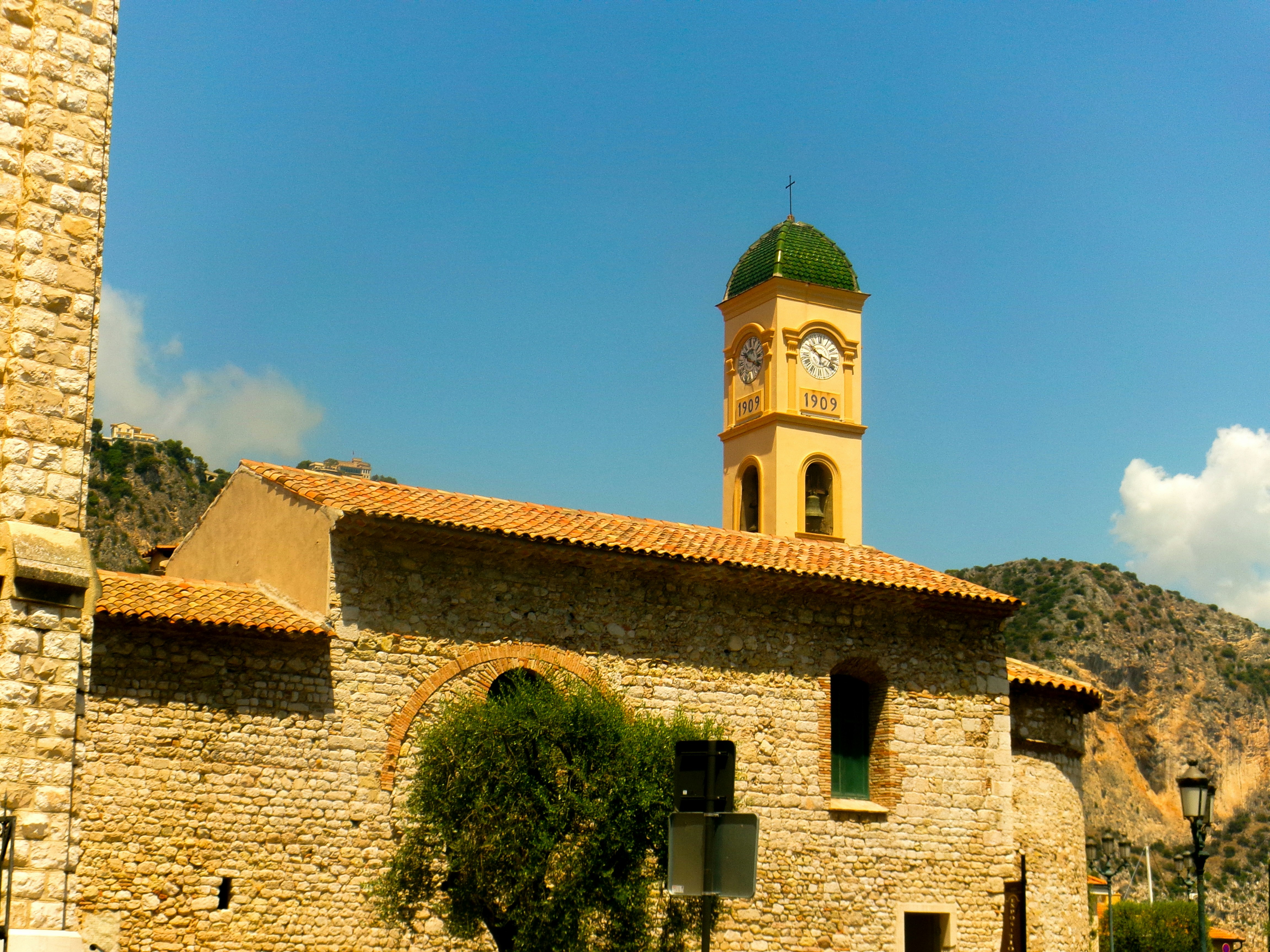 Stone Village Clock Tower bathed in late afternoon sun