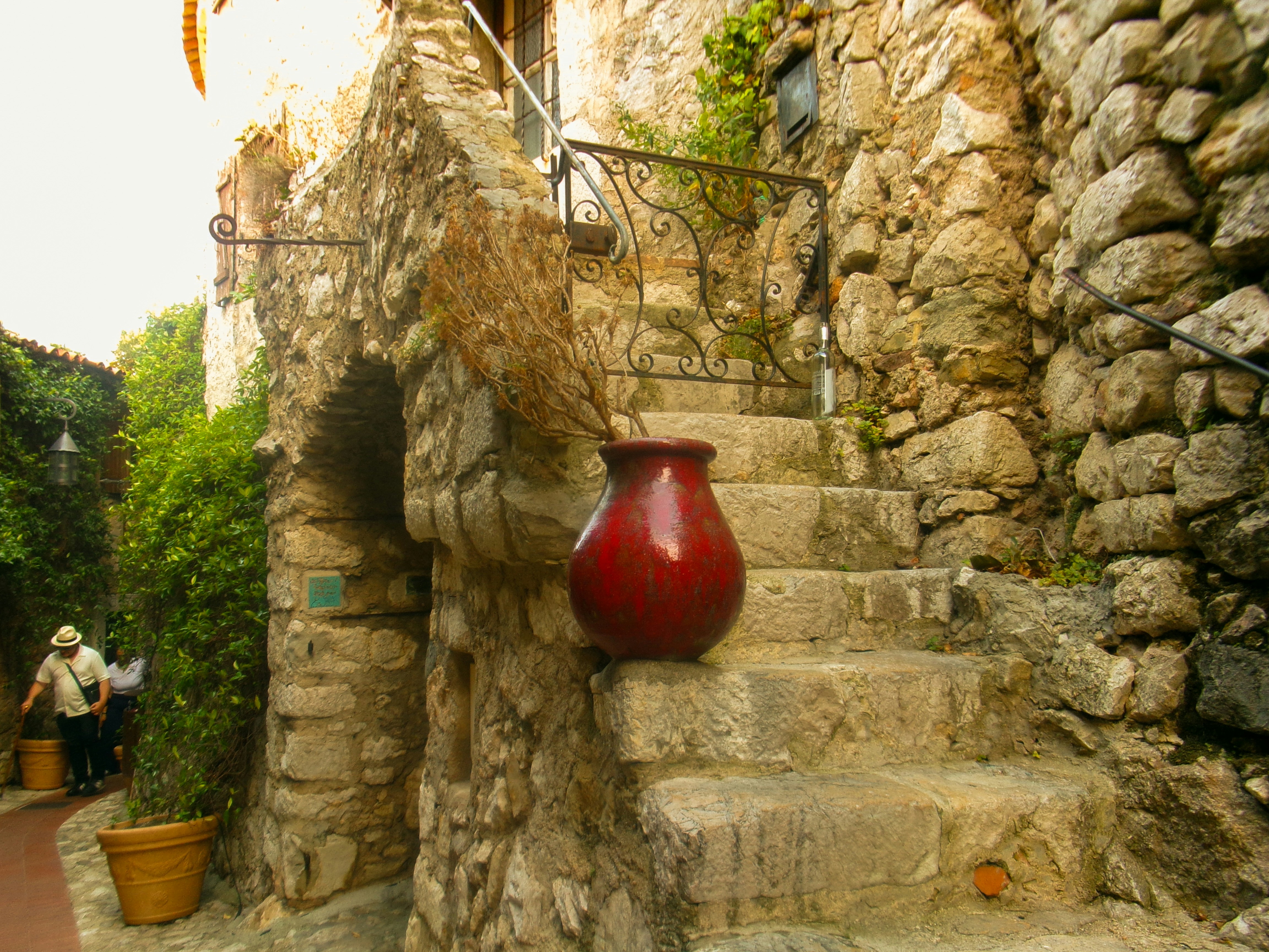Terracotta Vessel on Stone Steps in Medieval Courtyard