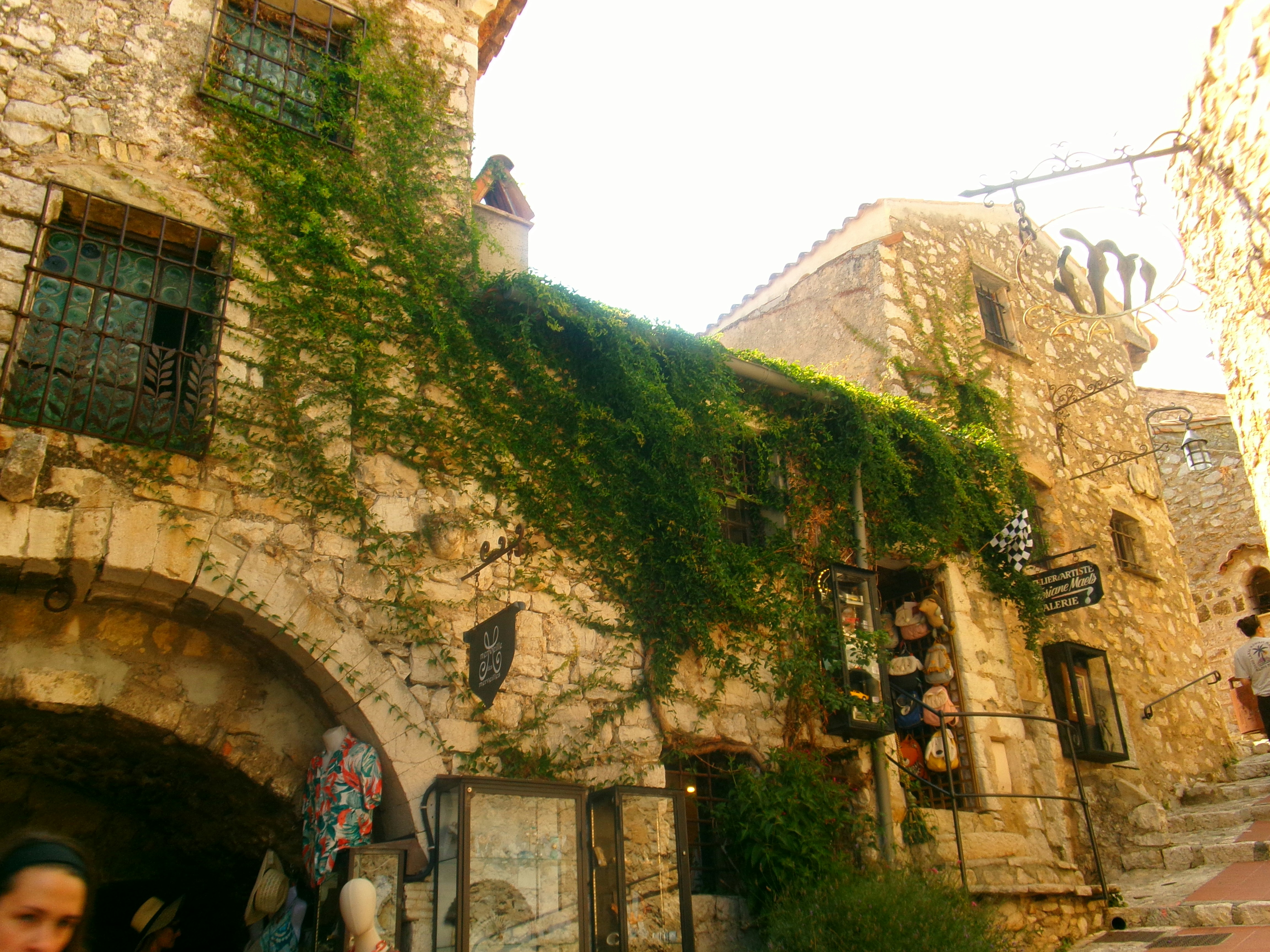 Stone Village Façade: Ivy-Clad Archway and Stairwell
