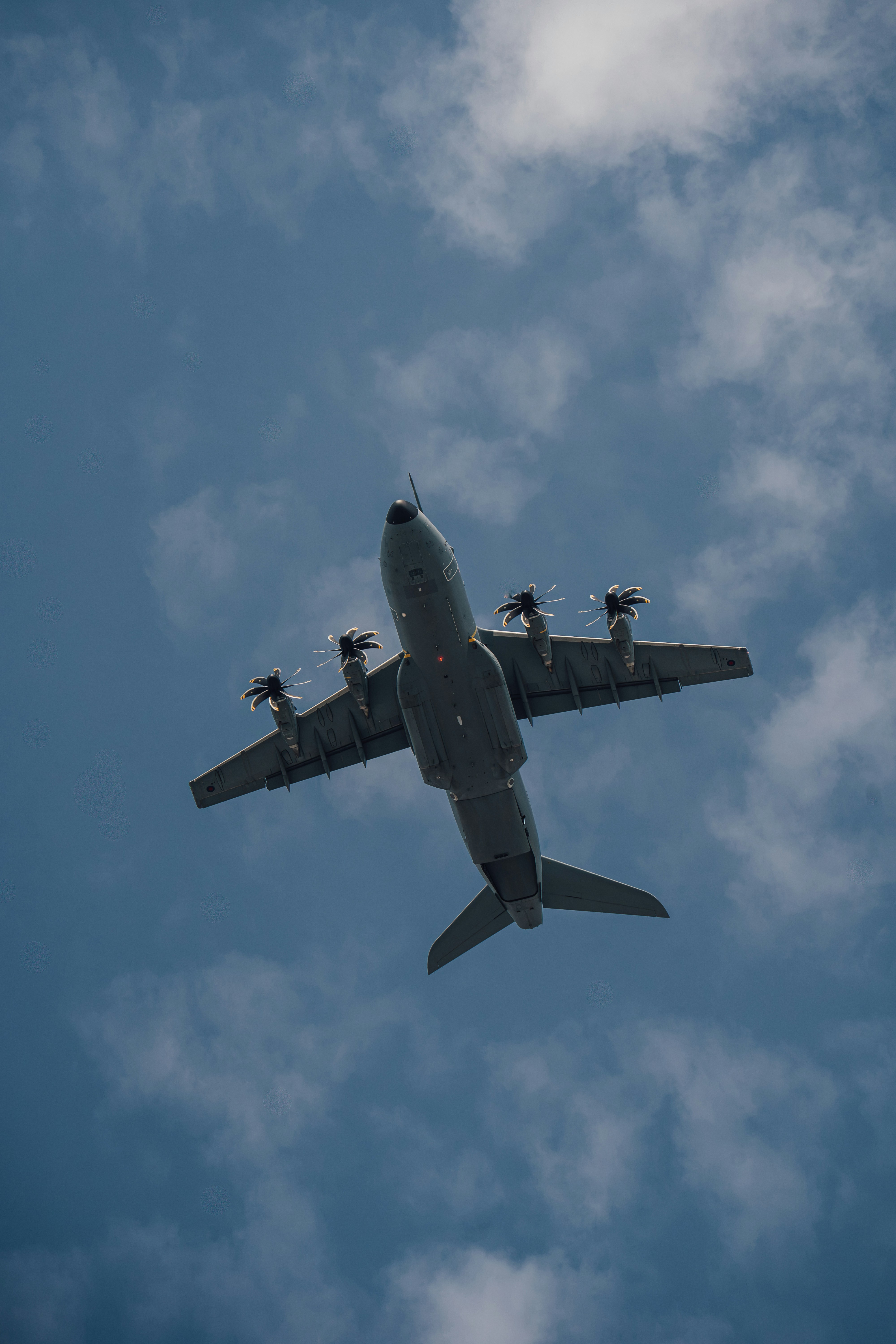 Midflight Giant: Aerial Freighter Against a Blue Sky