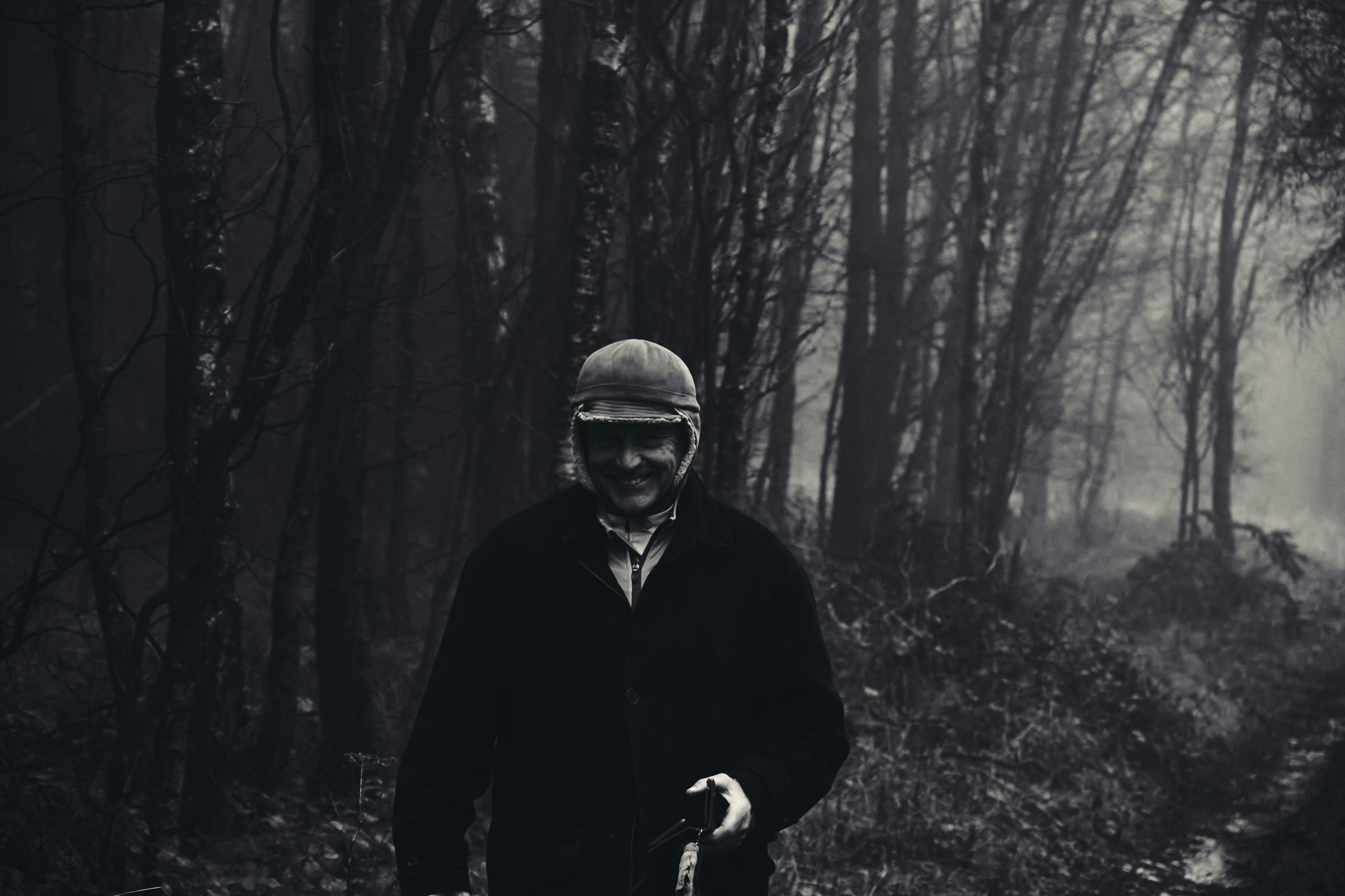 Midnight Trek: A Solitary Figure Through Forsaken Pines