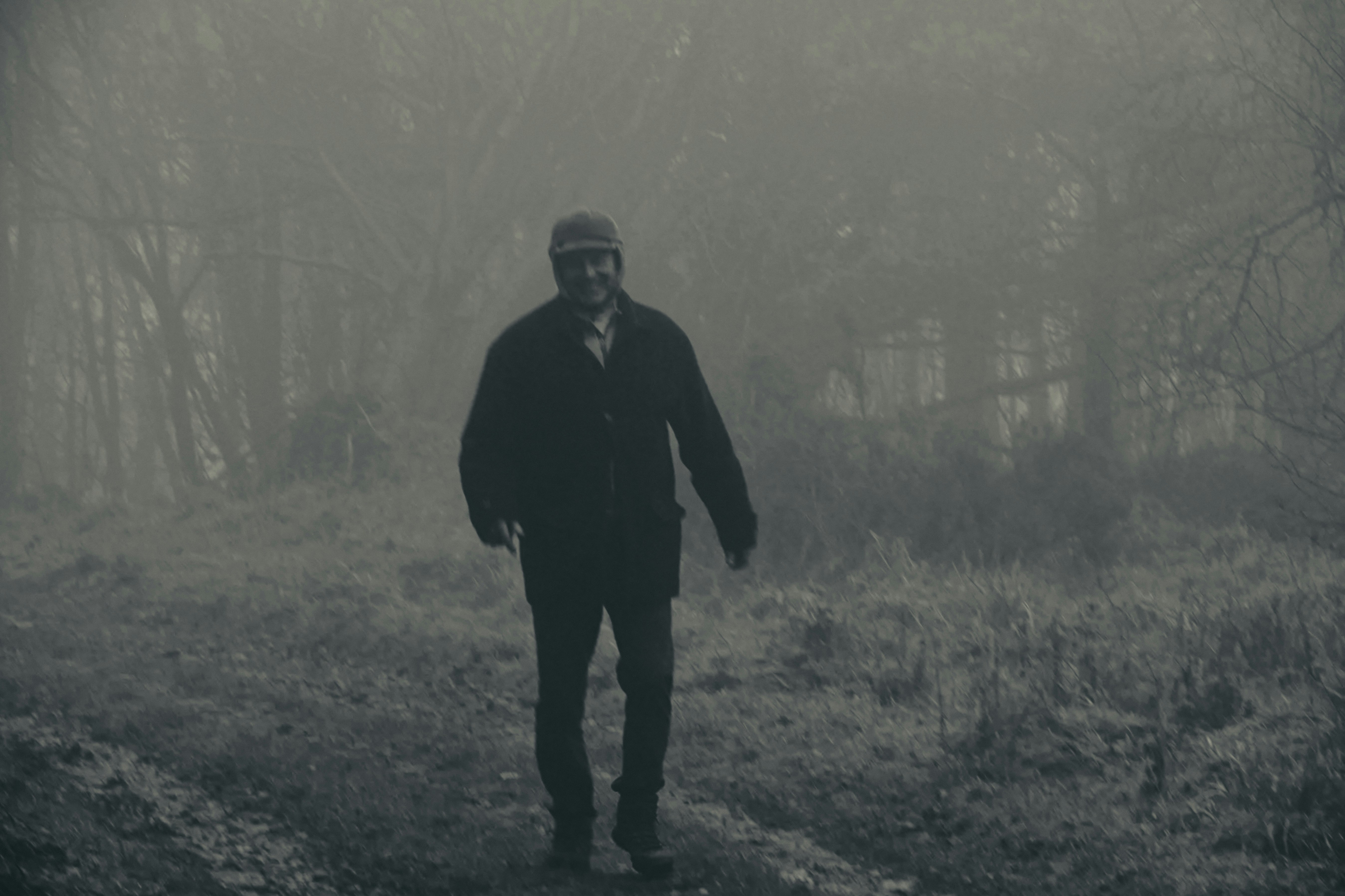 Misty Wanderer in a Quiet Woodland Path