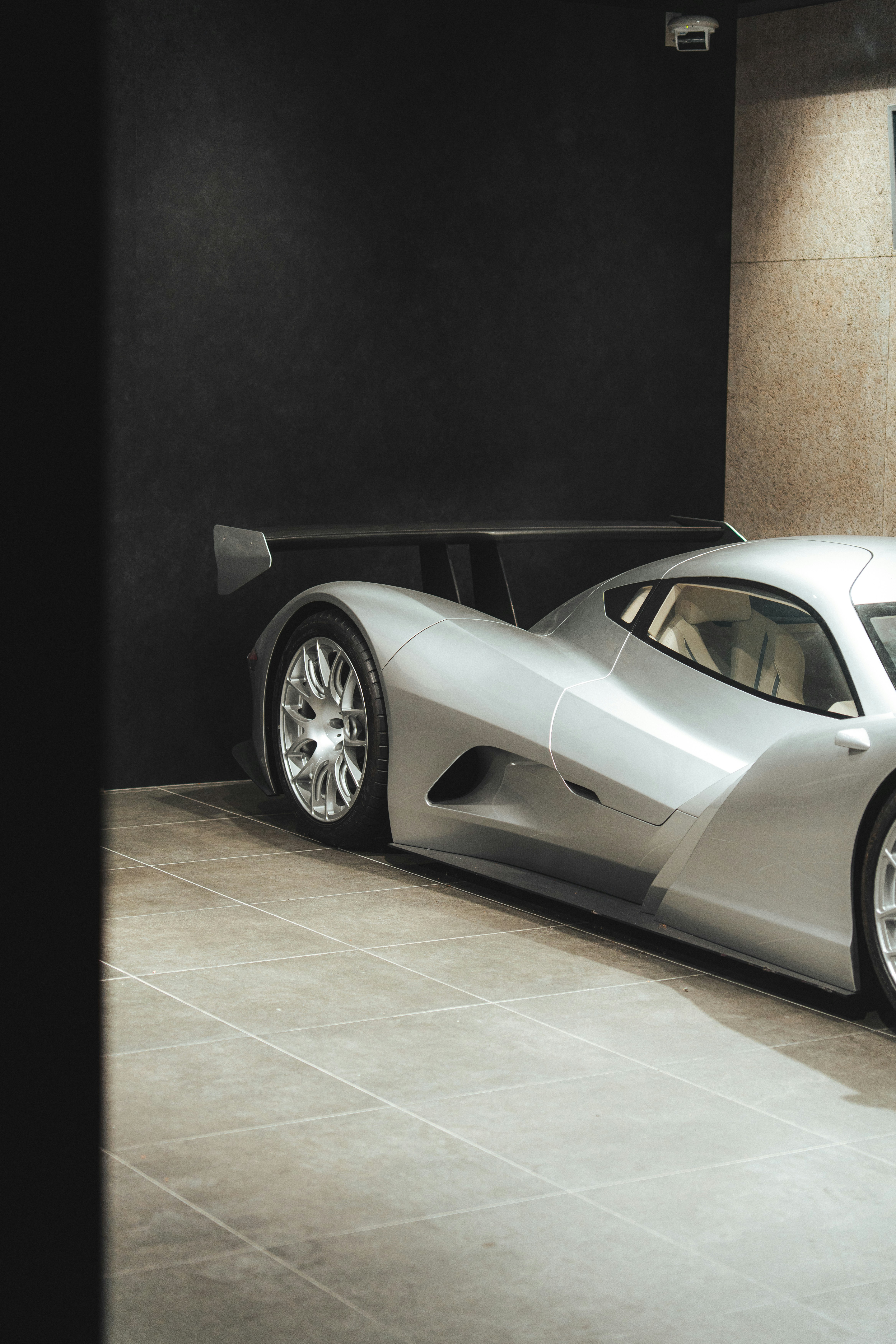 Chrome Crucible: A Sleek Hypercar Emerges from the Shadows