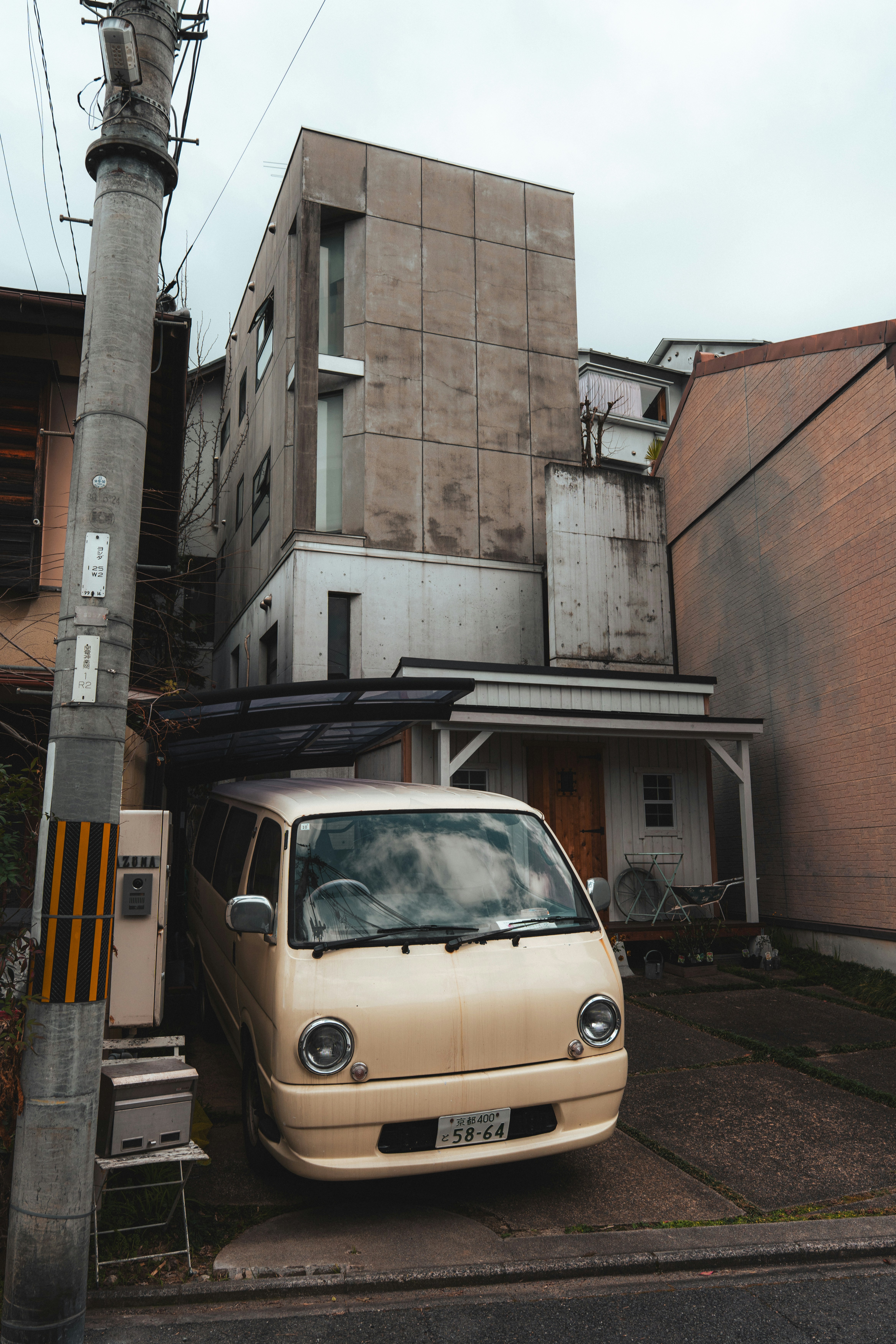 Vintage van under a weathered urban façade