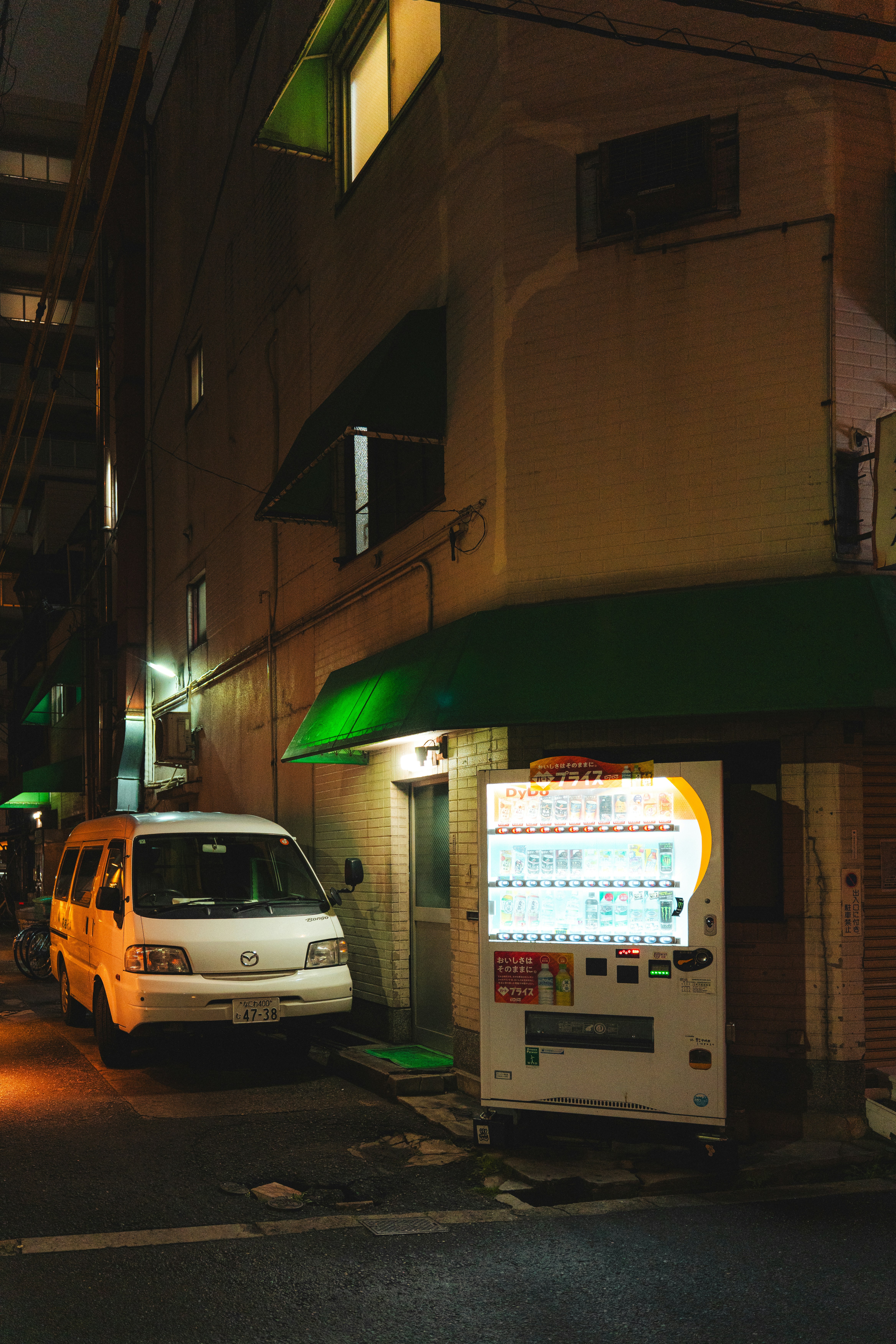 Neon Green Canopy, Quiet Alley: A Night in the Vending District