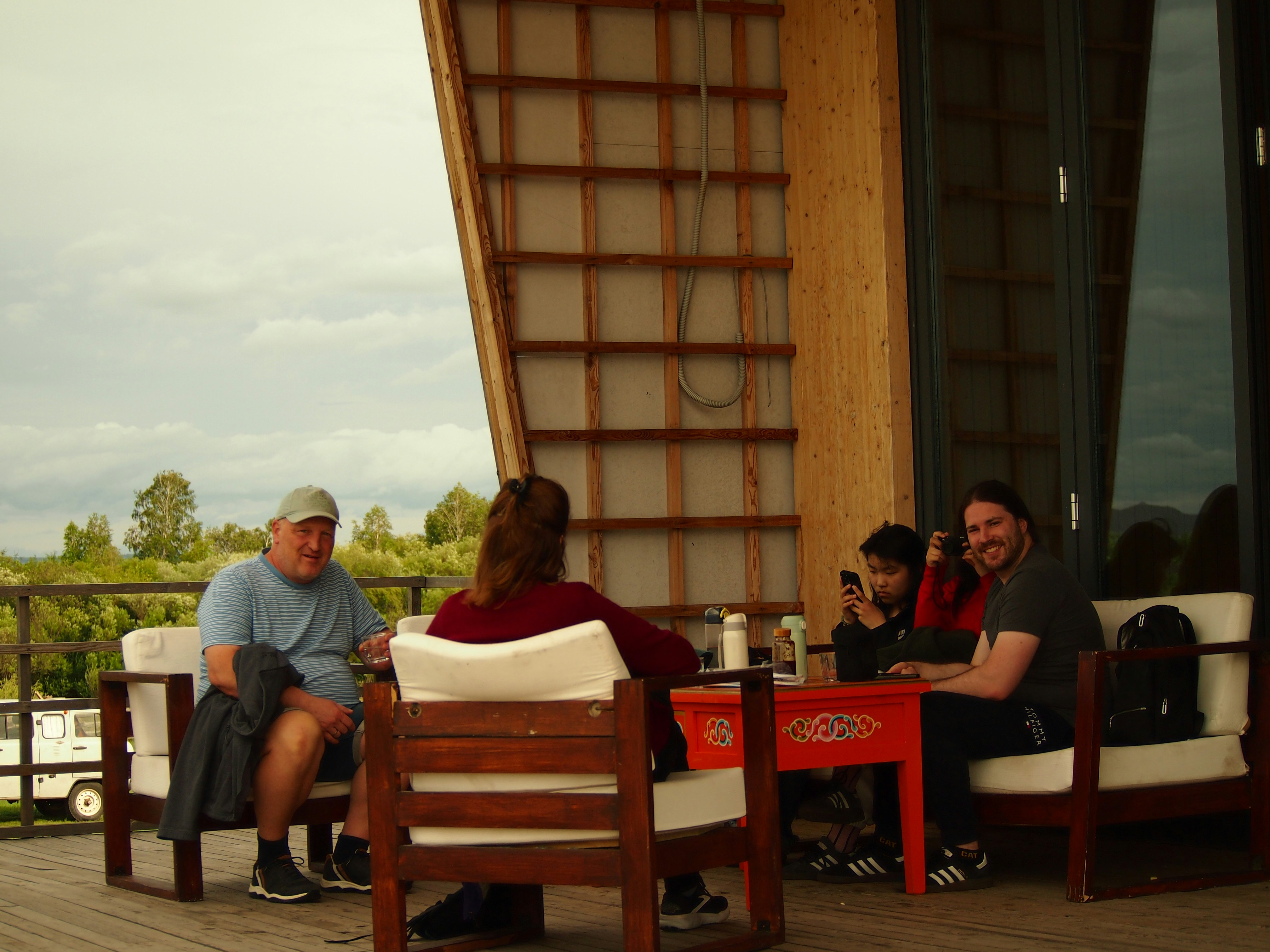 Lakeside Lounge: Friends Gathered on a Sunny Deck