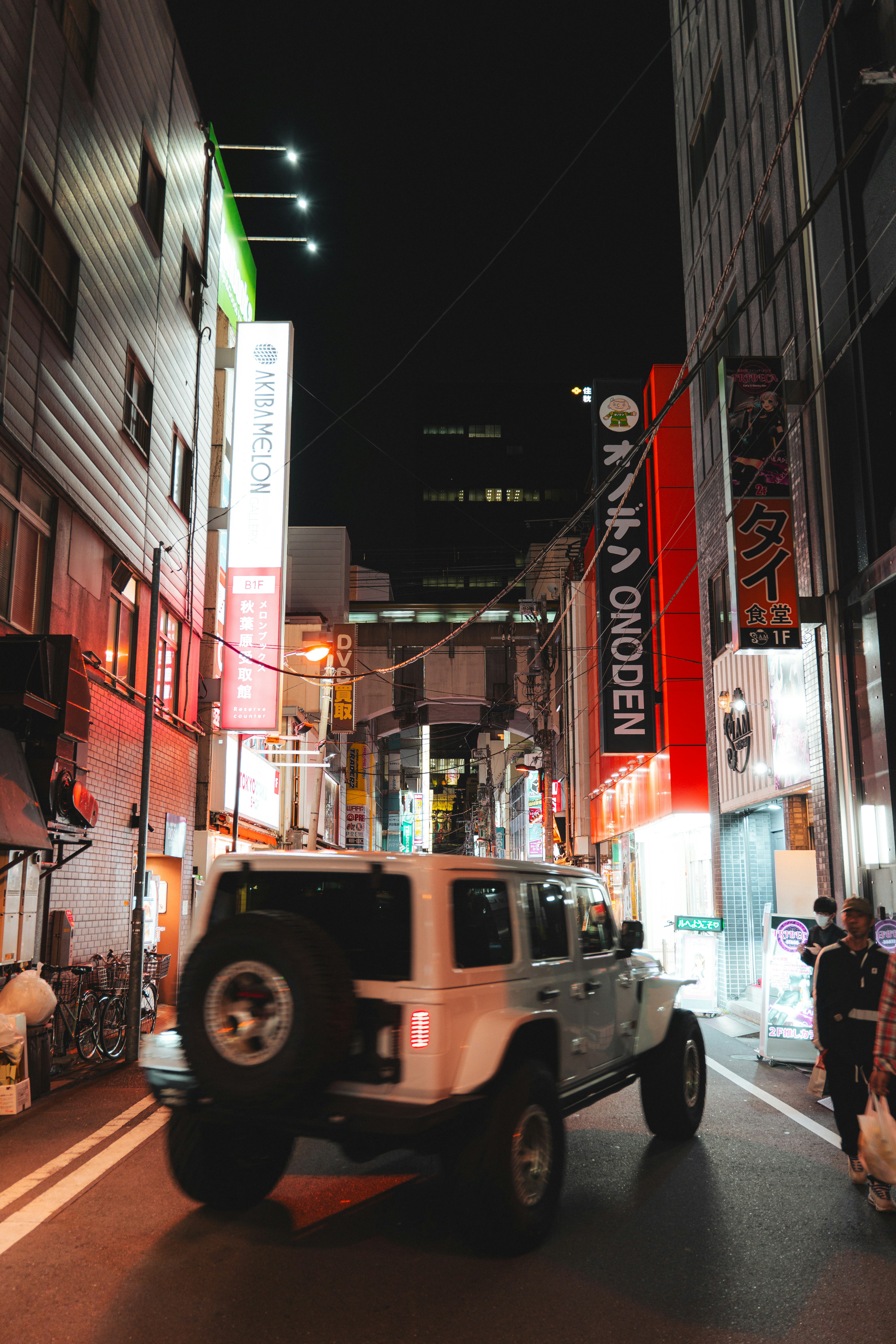 Midnight City Drift: A Neon-Bathed Jeep in a Tokyo-Street Alley