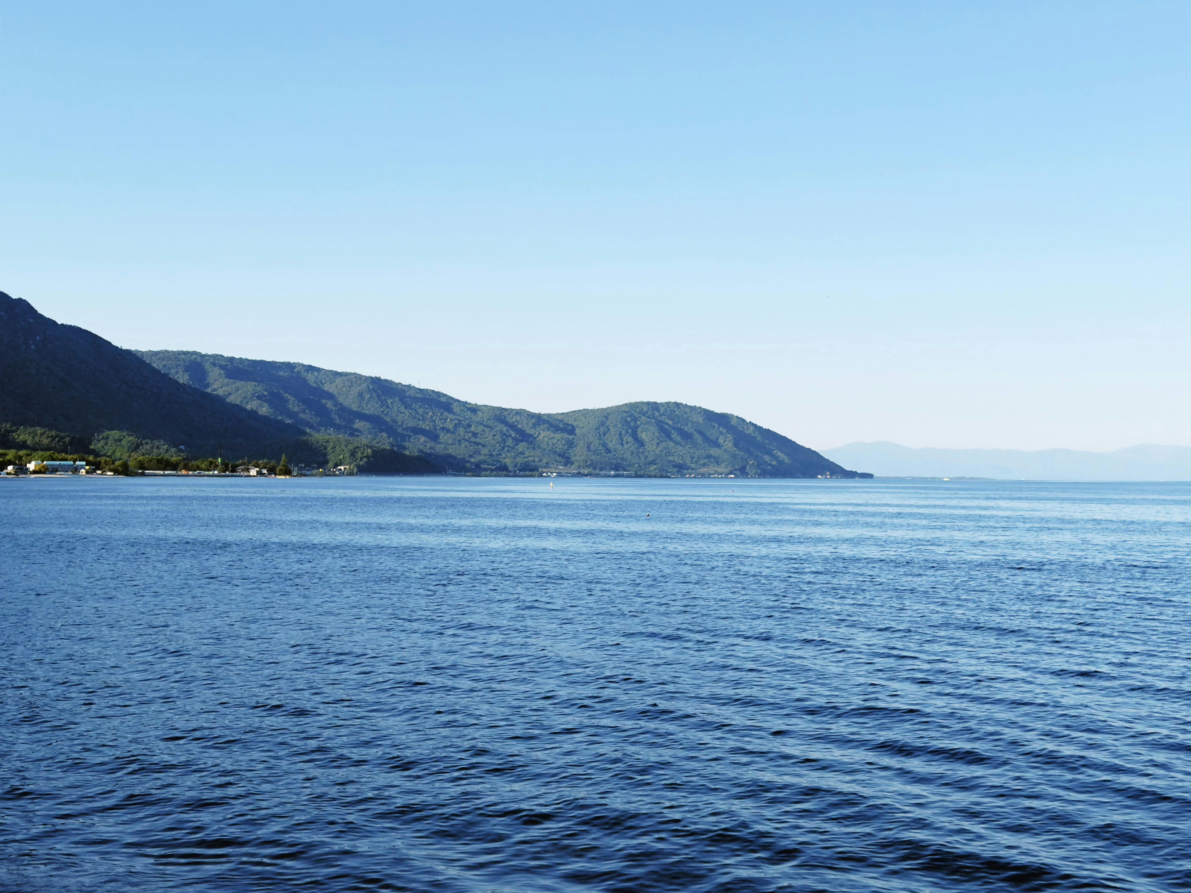 Calm Horizon: Coastal Ridge Meeting a Quiet Sea