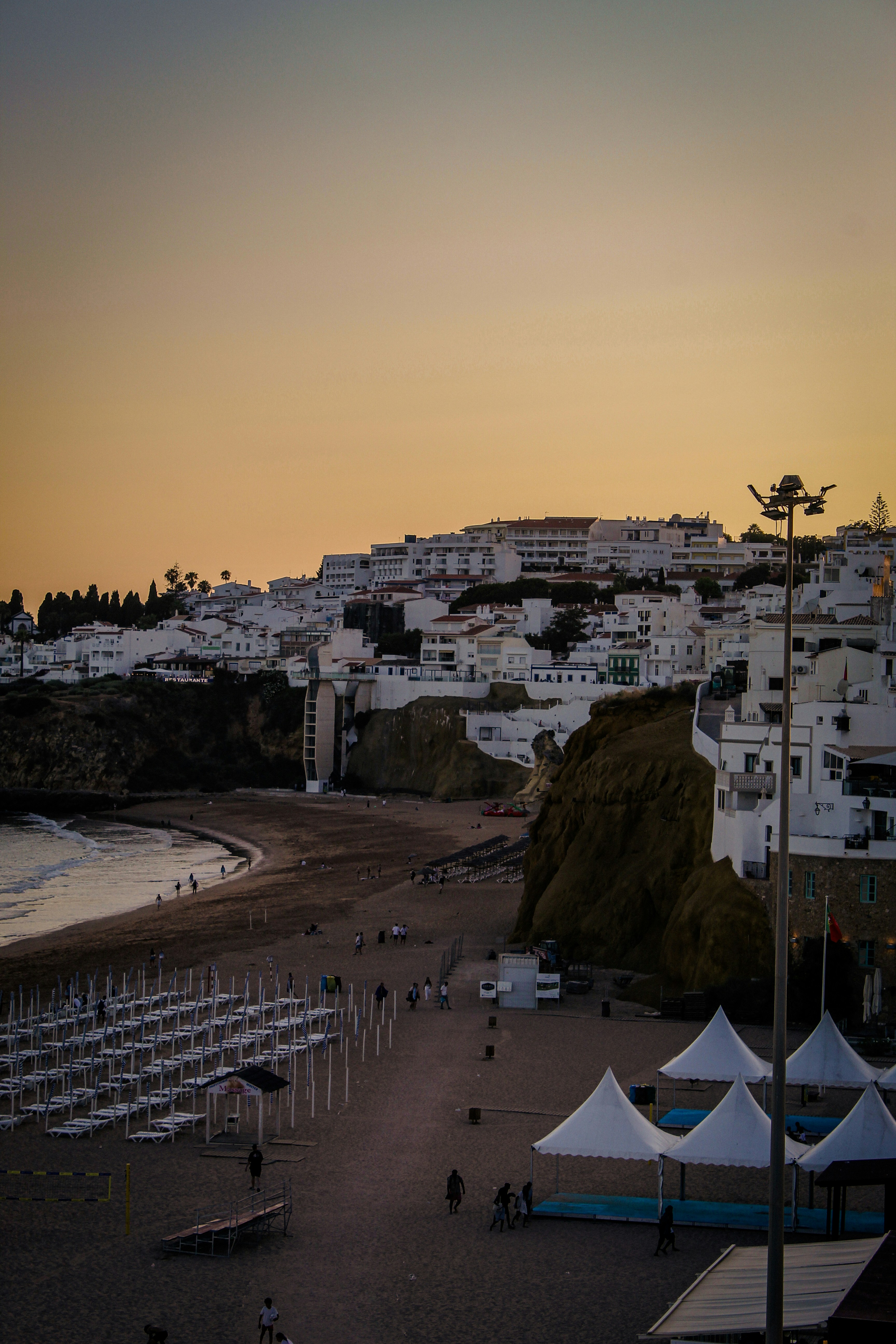 Sunset Over a Cliffside Beach Town