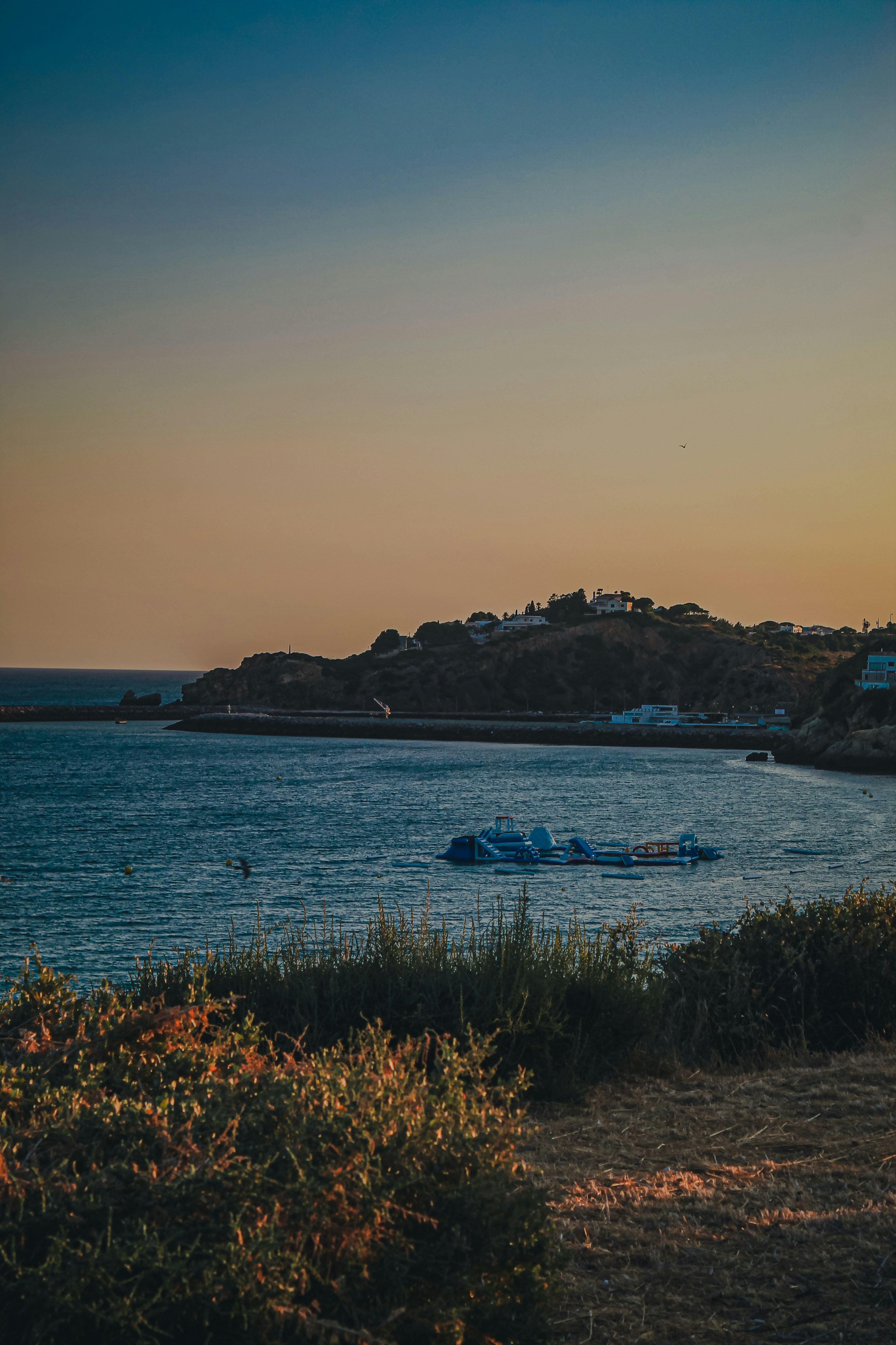 Sunset Harbor: Boats at Distant Breakwater
