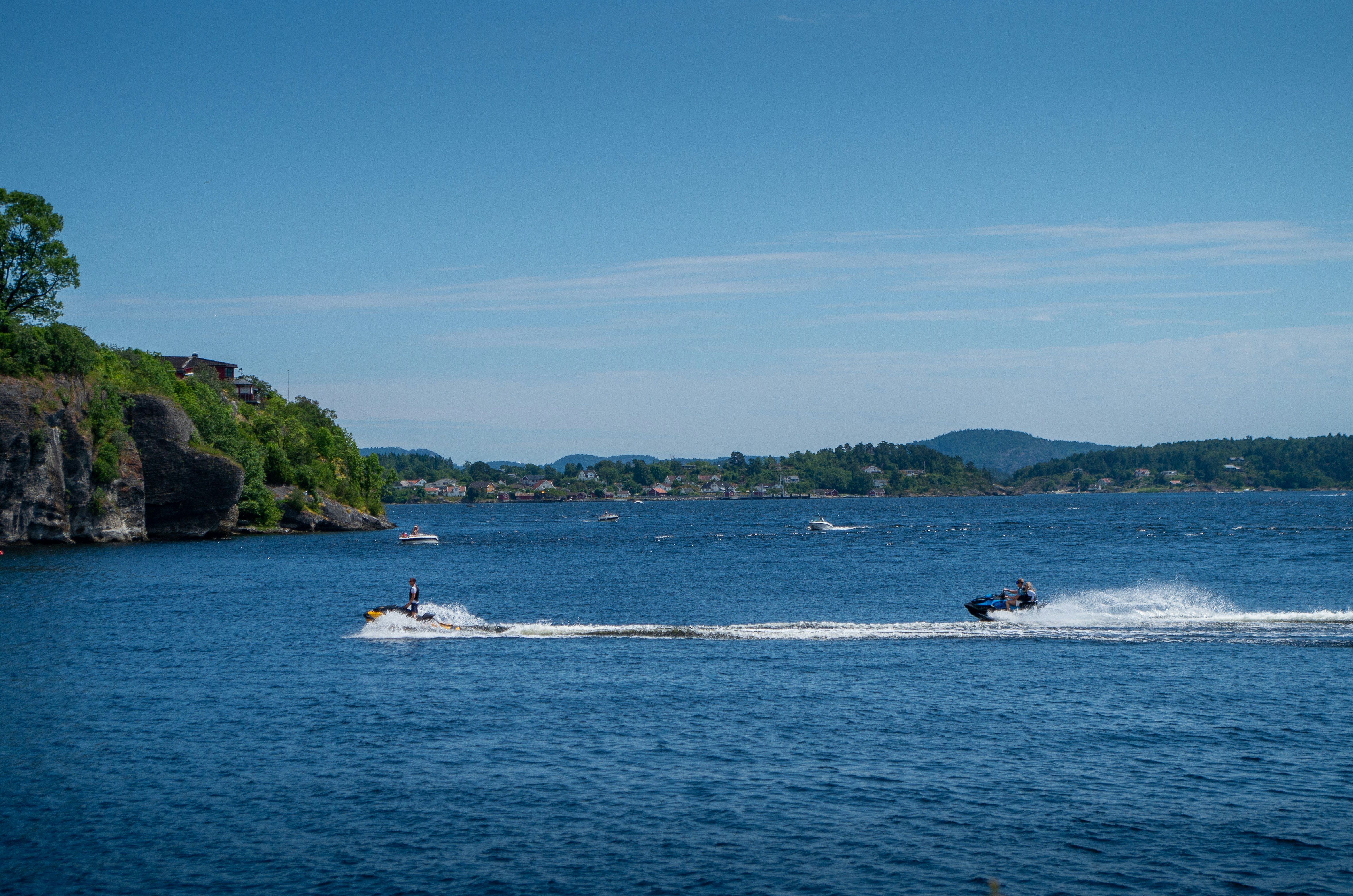 Jet-Ski Trails Across a Quiet Blue Sea