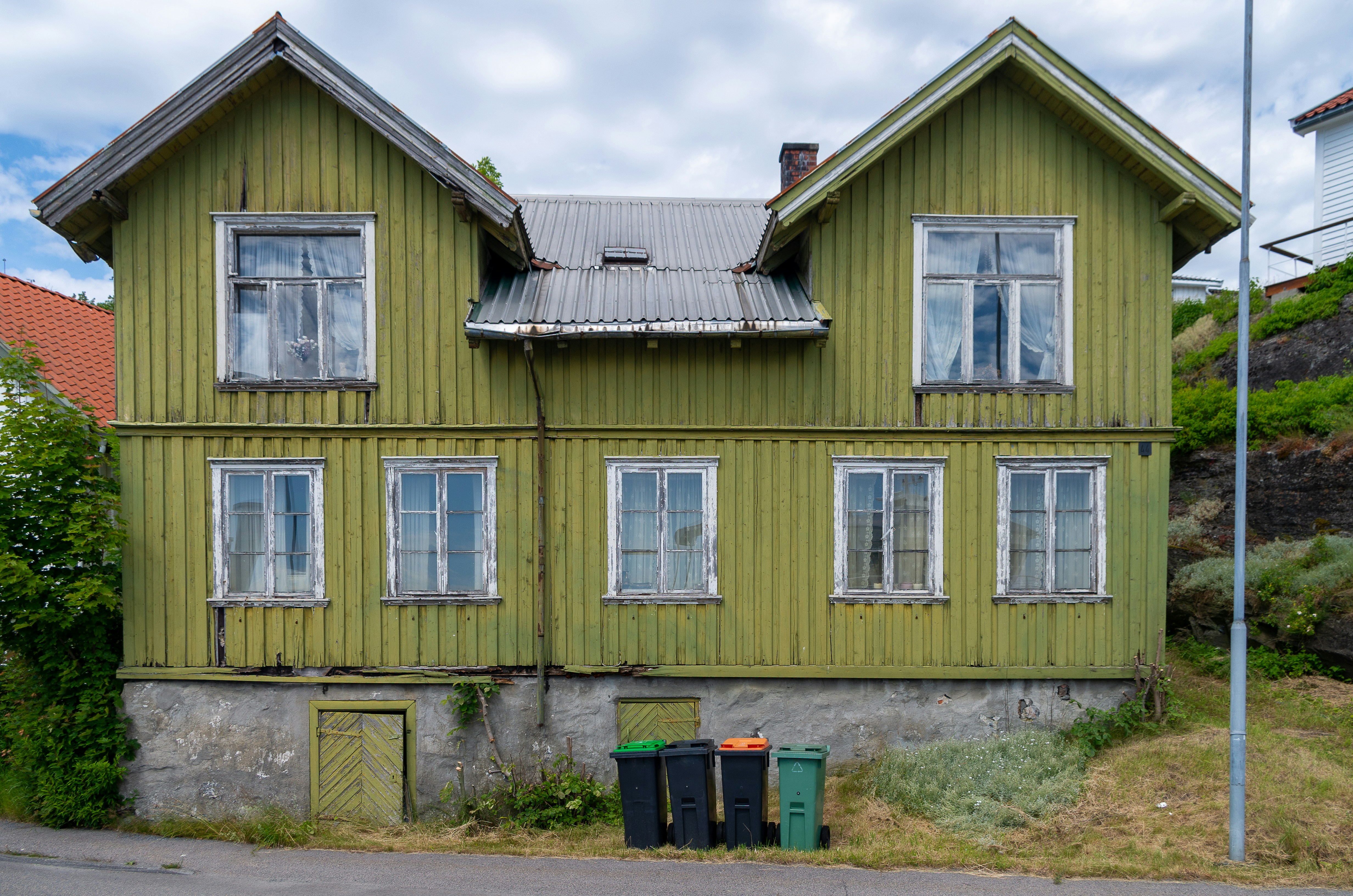 Forgotten Green House with Weathered Charm