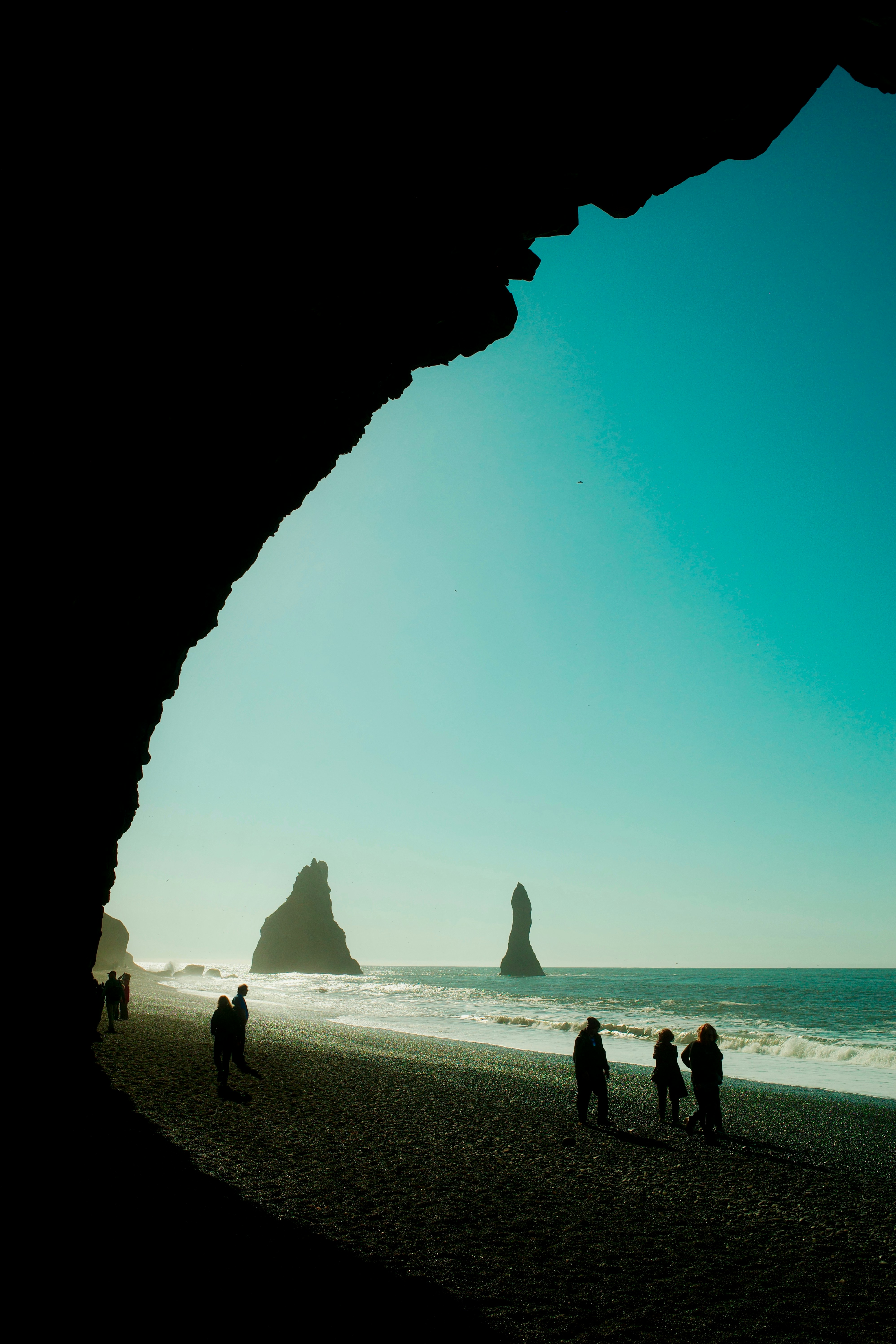 Cave Archway Framing a Coastal silhouette at Sunset