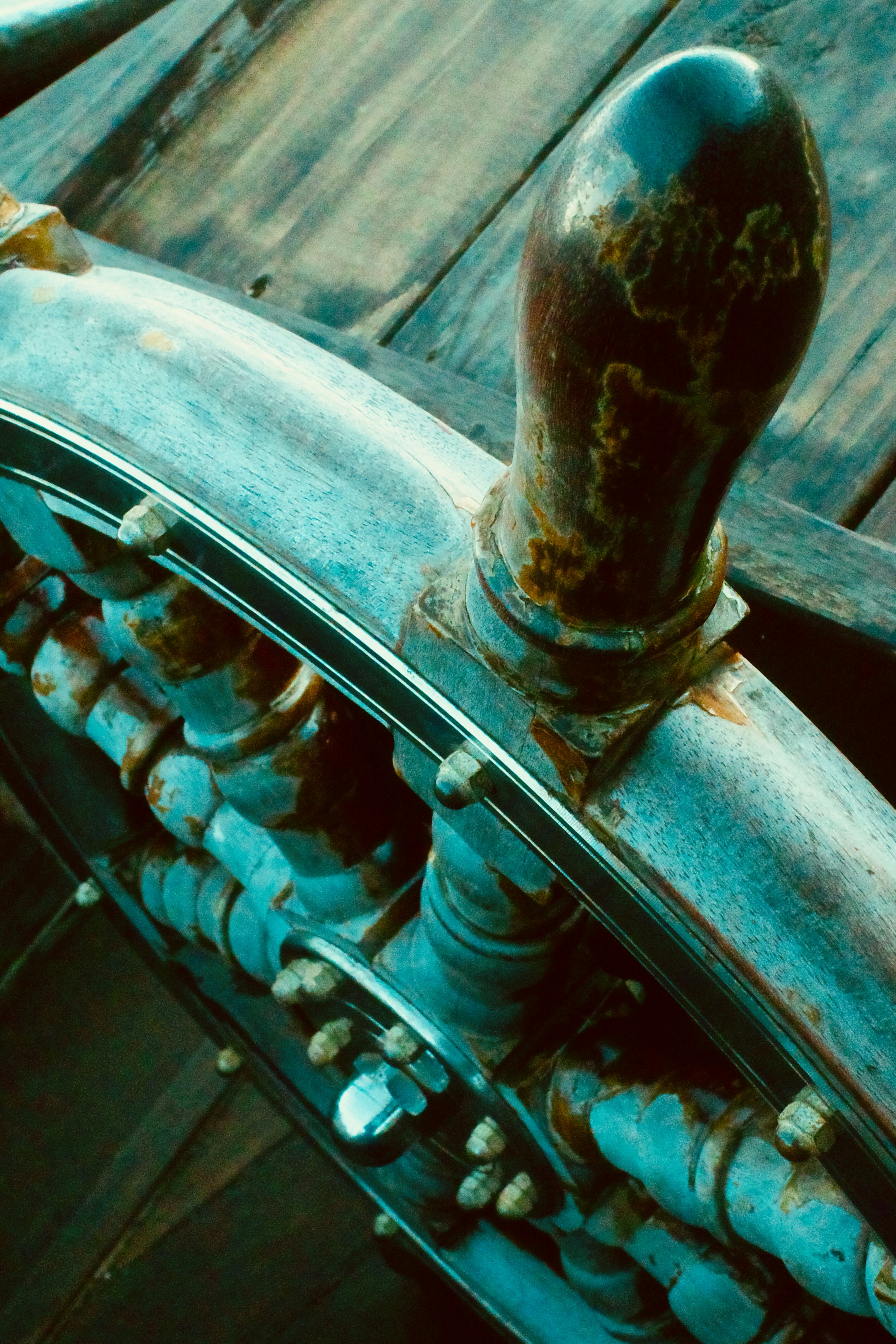Rust and Reflection on a Nautical Wheel