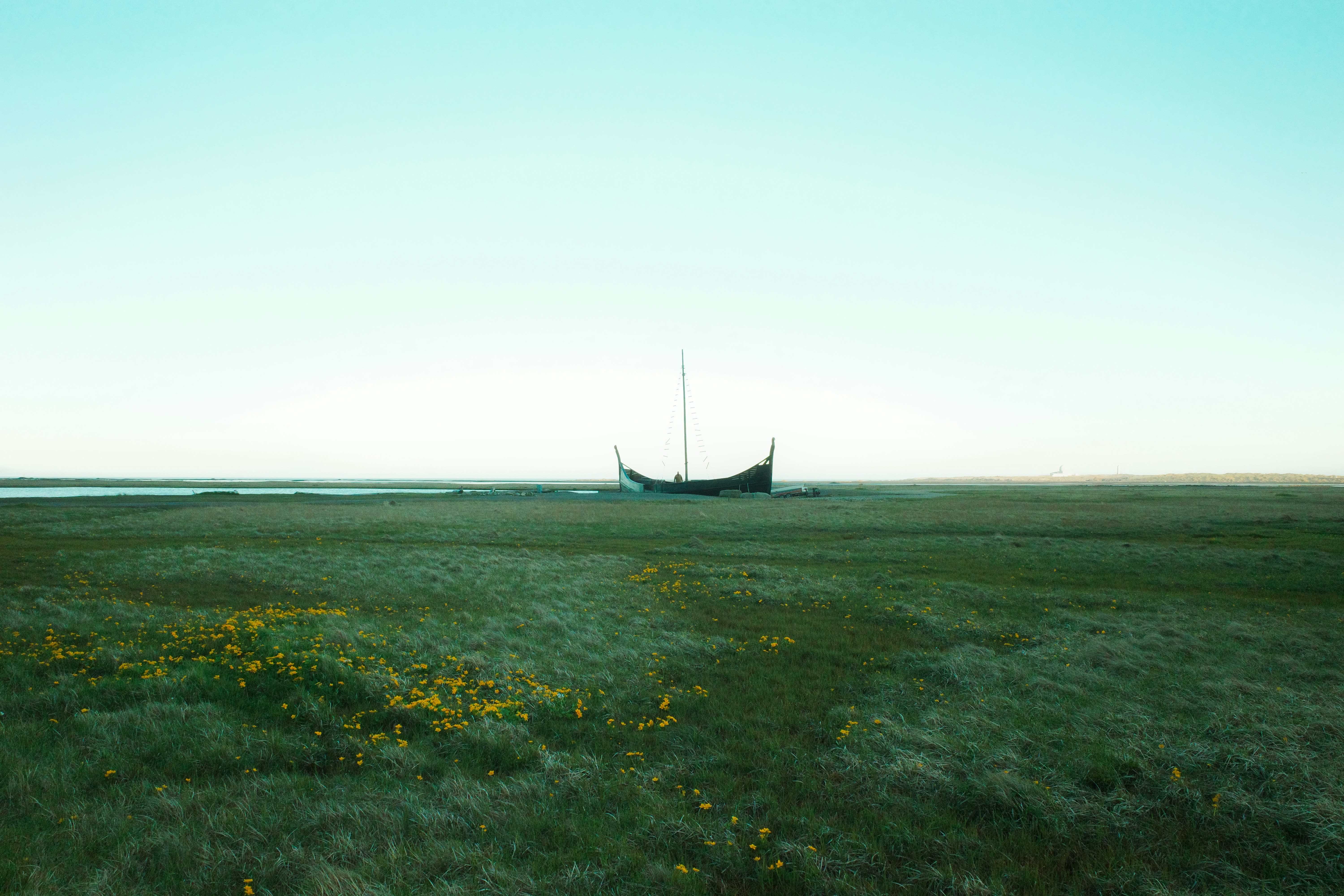 Lonely Schooner at the Sea’s Edge
