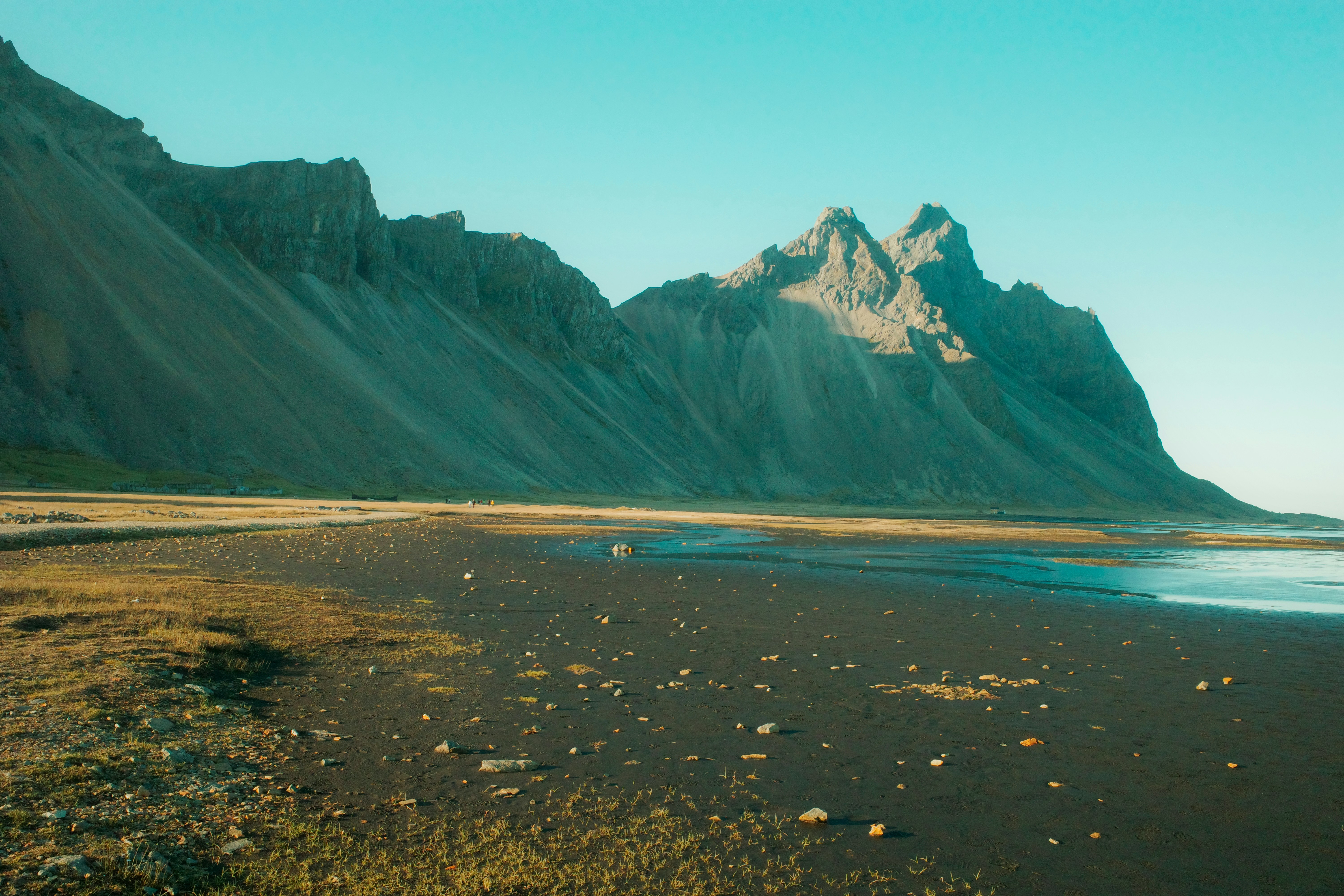 Coastal Ridge under a Teal Sky