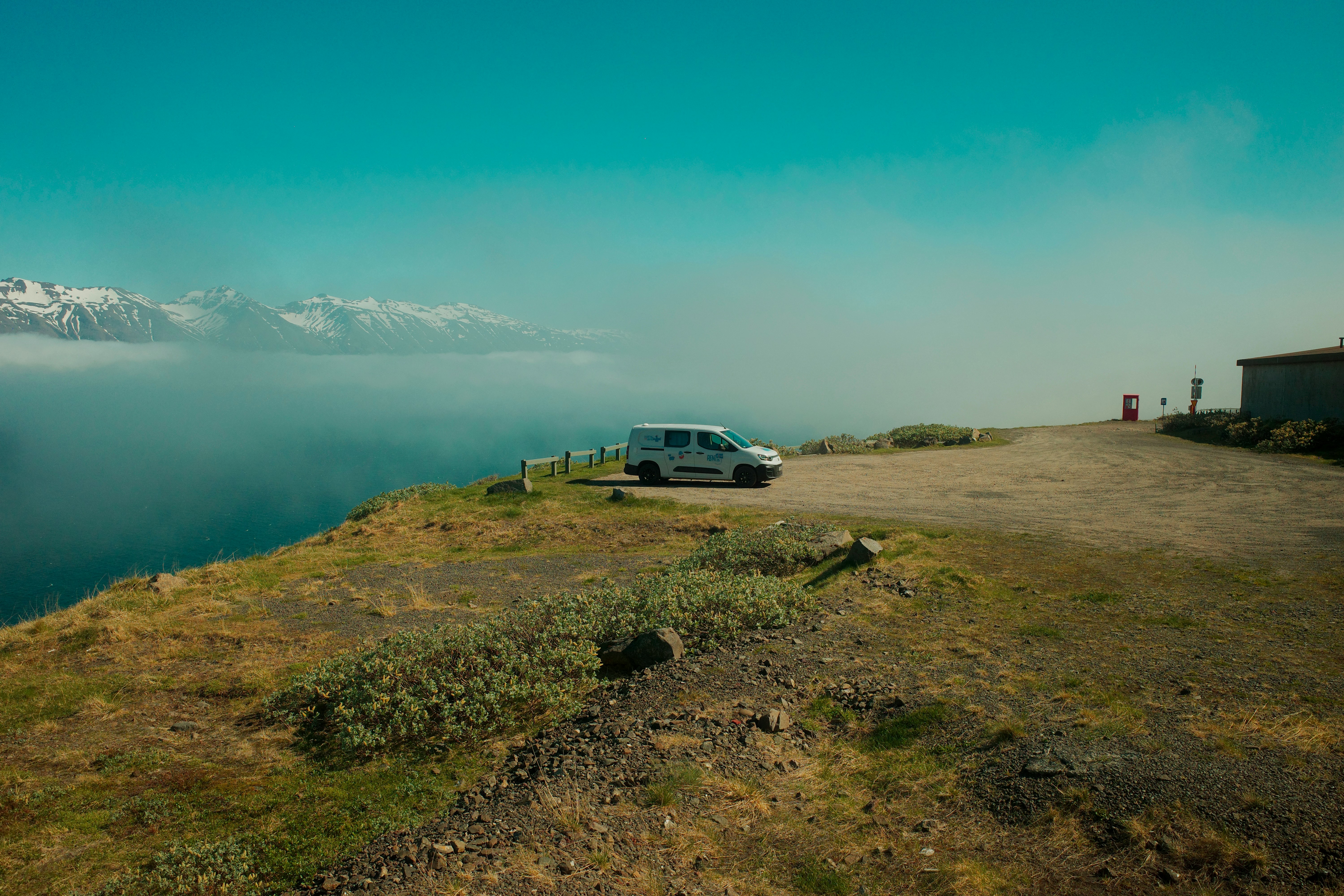 Quiet overlook: a lone van at the edge of the world