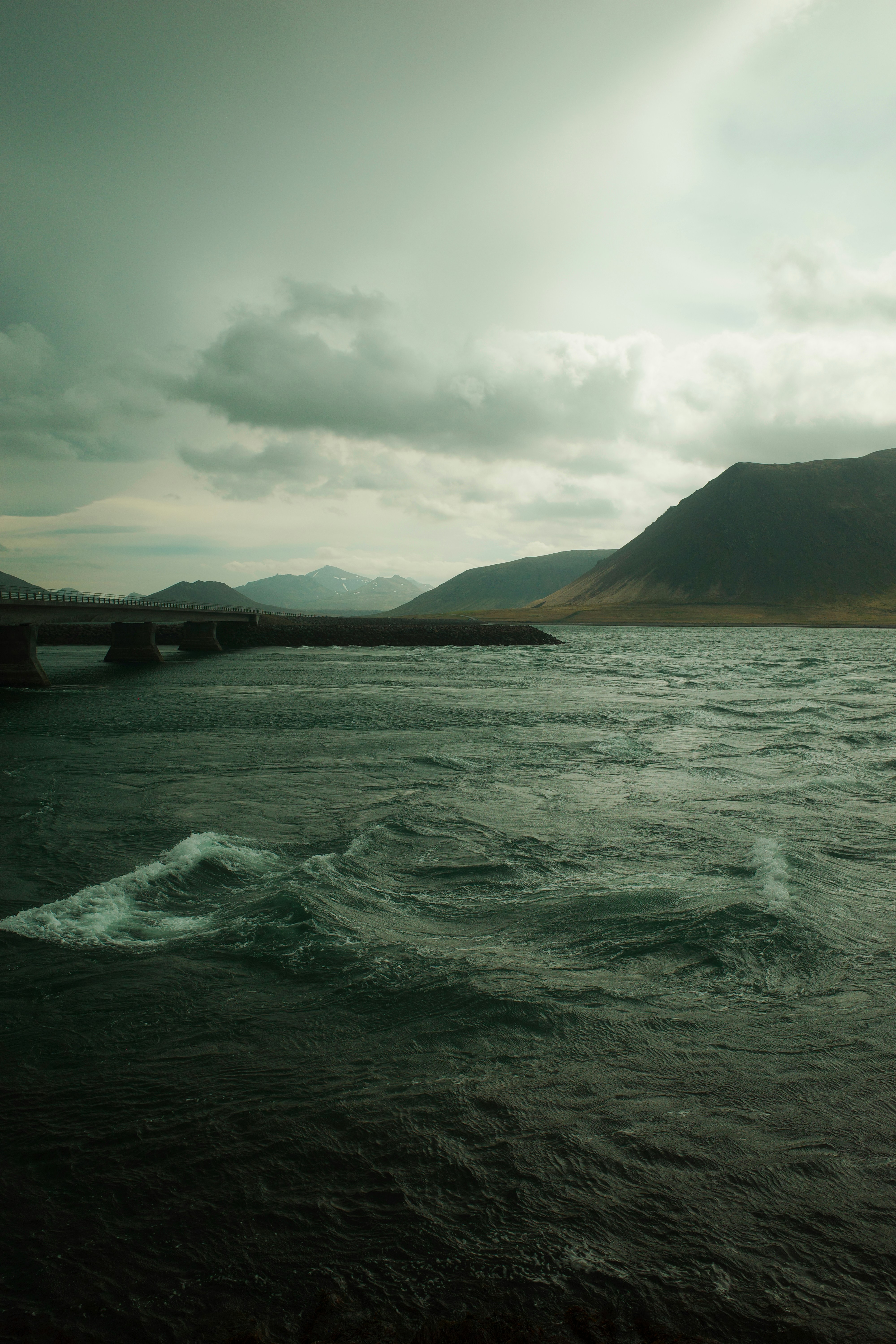A Quiet Fjord: Wind-Tossed Waters Beneath Painted Clouds